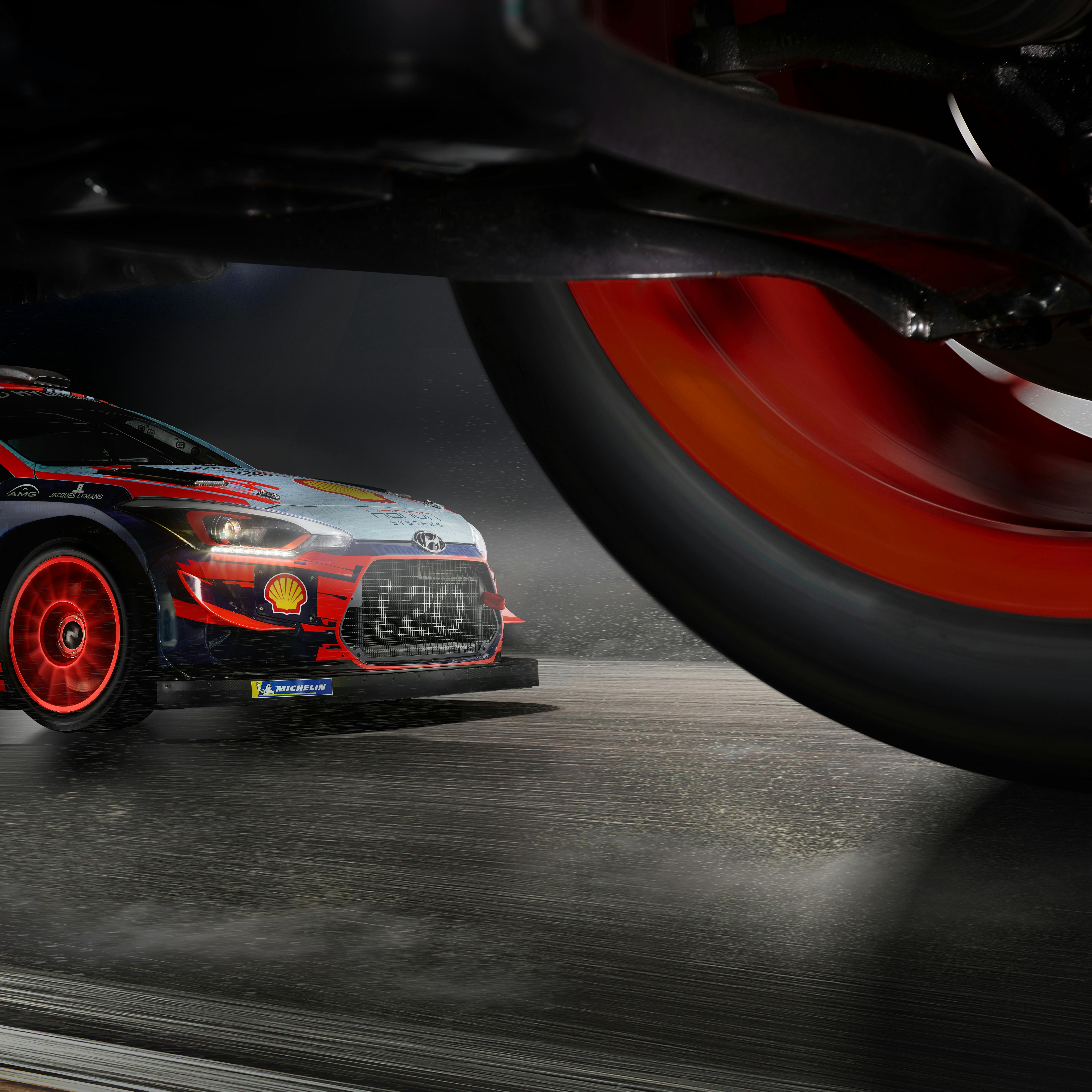 Red Racing Car on Race Track during Daytime · Free Stock Photo