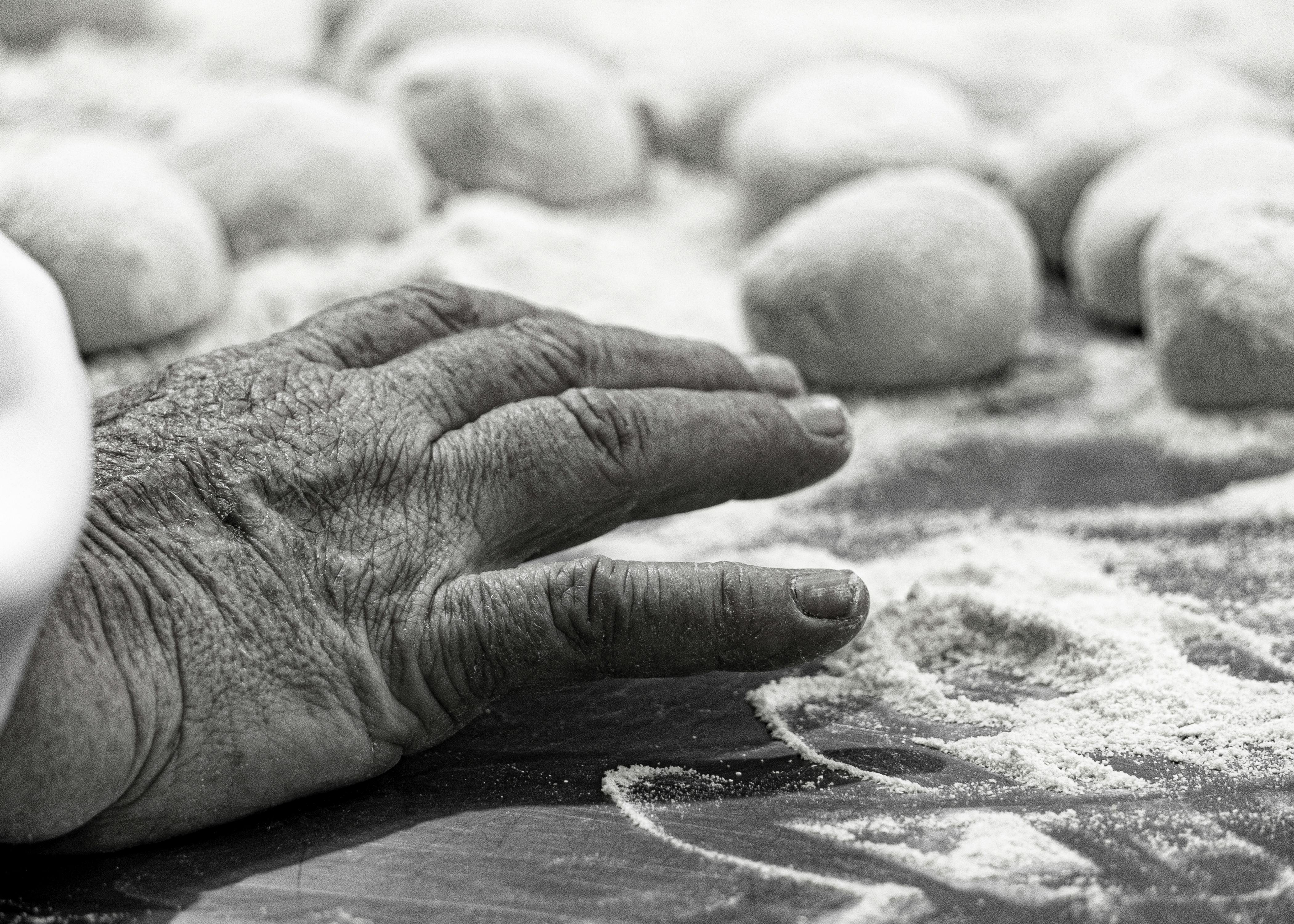 Grayscale Photo of Person's Wrinkled Hand · Free Stock Photo