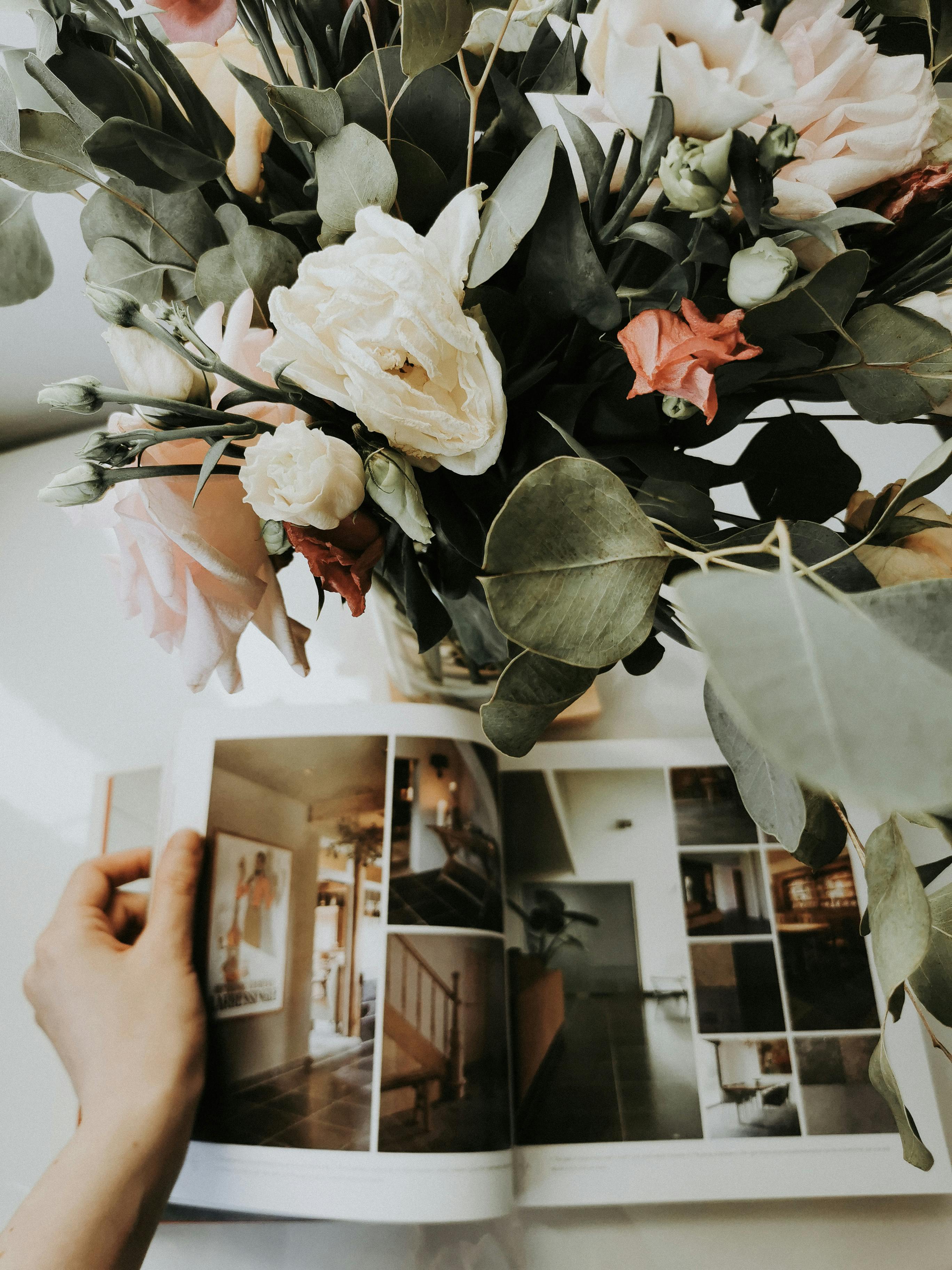 A Person Flipping Pages of a Magazine · Free Stock Photo