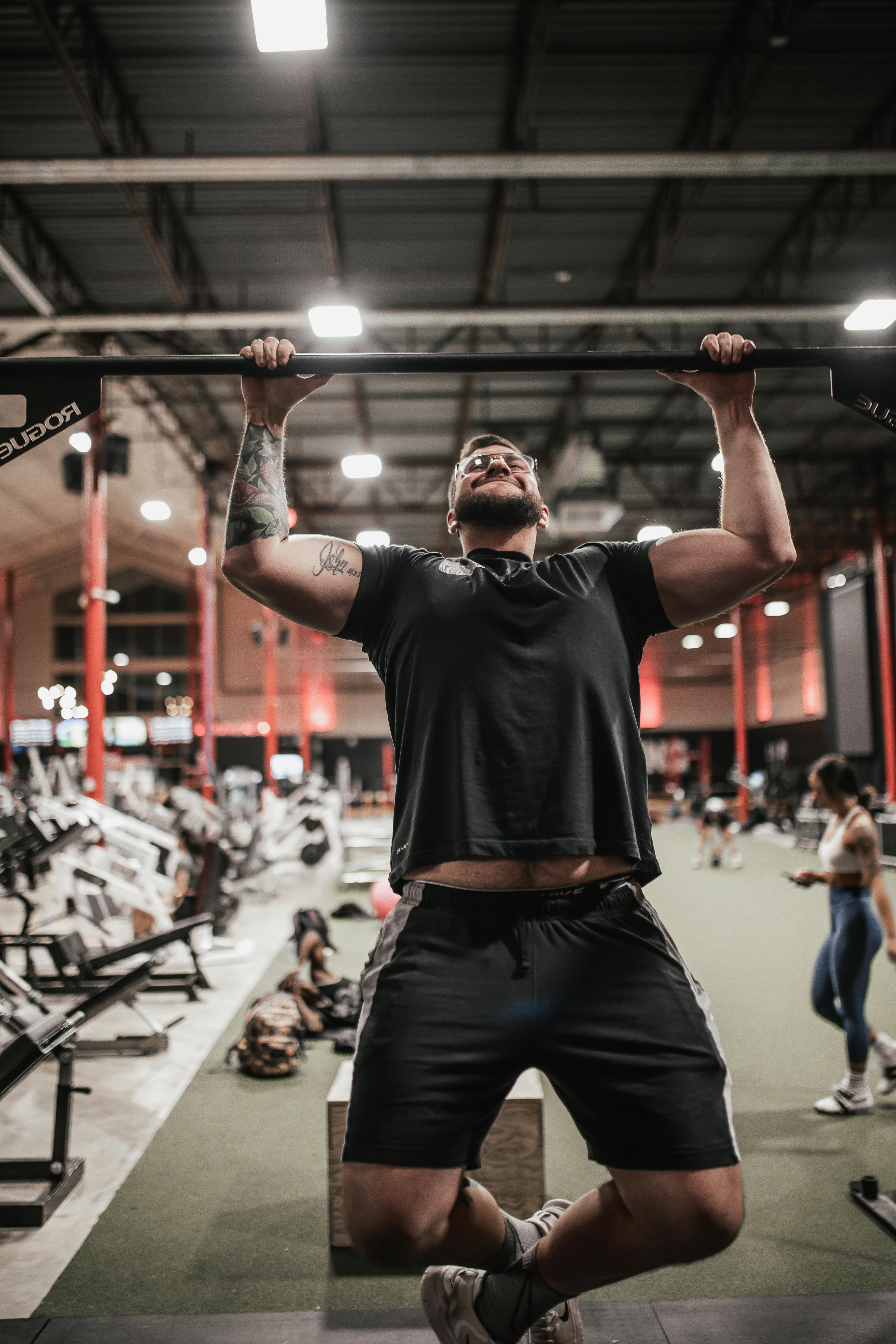A Shirtless Man Doing Pull Ups · Free Stock Photo
