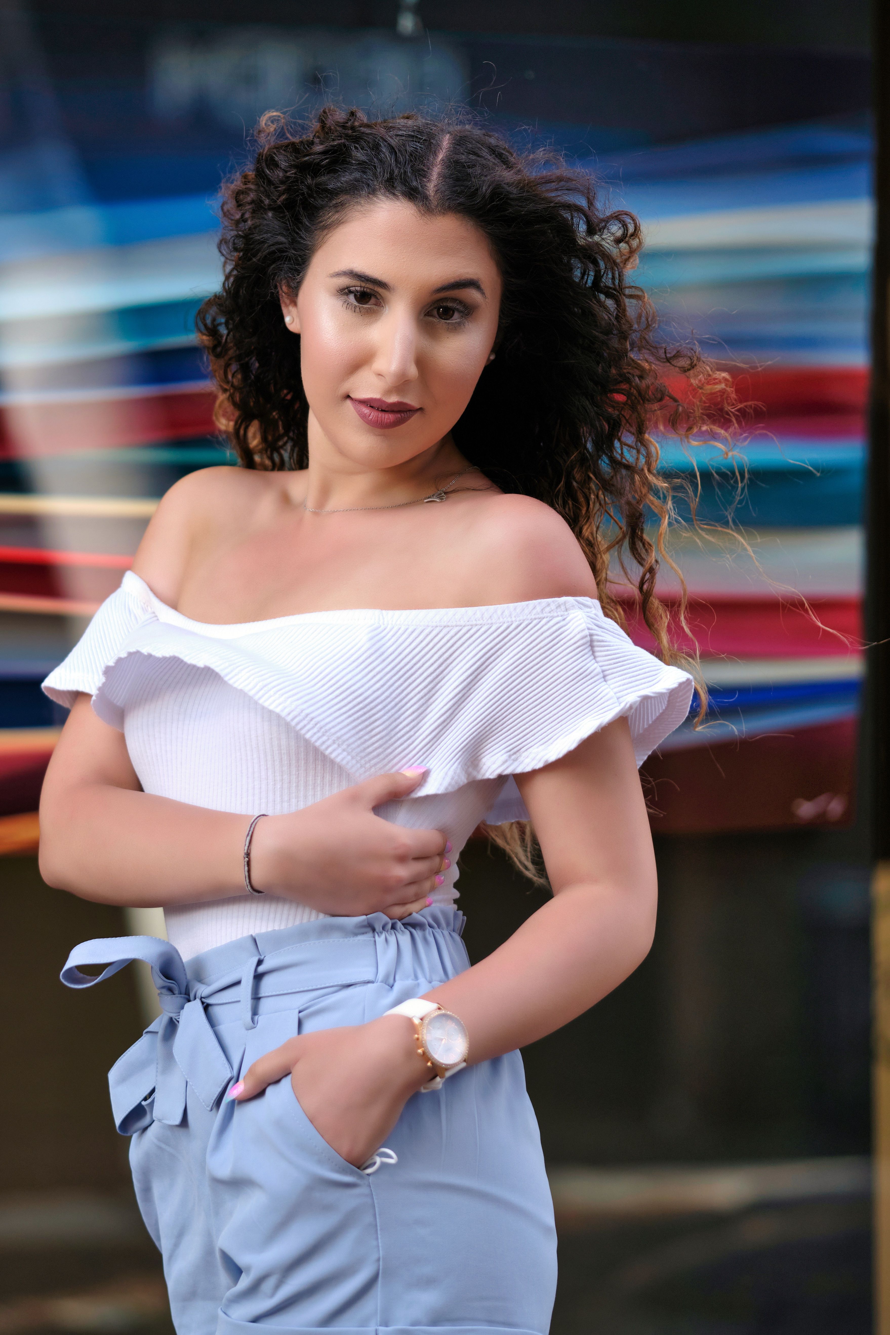 Girl Wearing a White Off Shoulder Top and Denim Shorts · Free Stock Photo