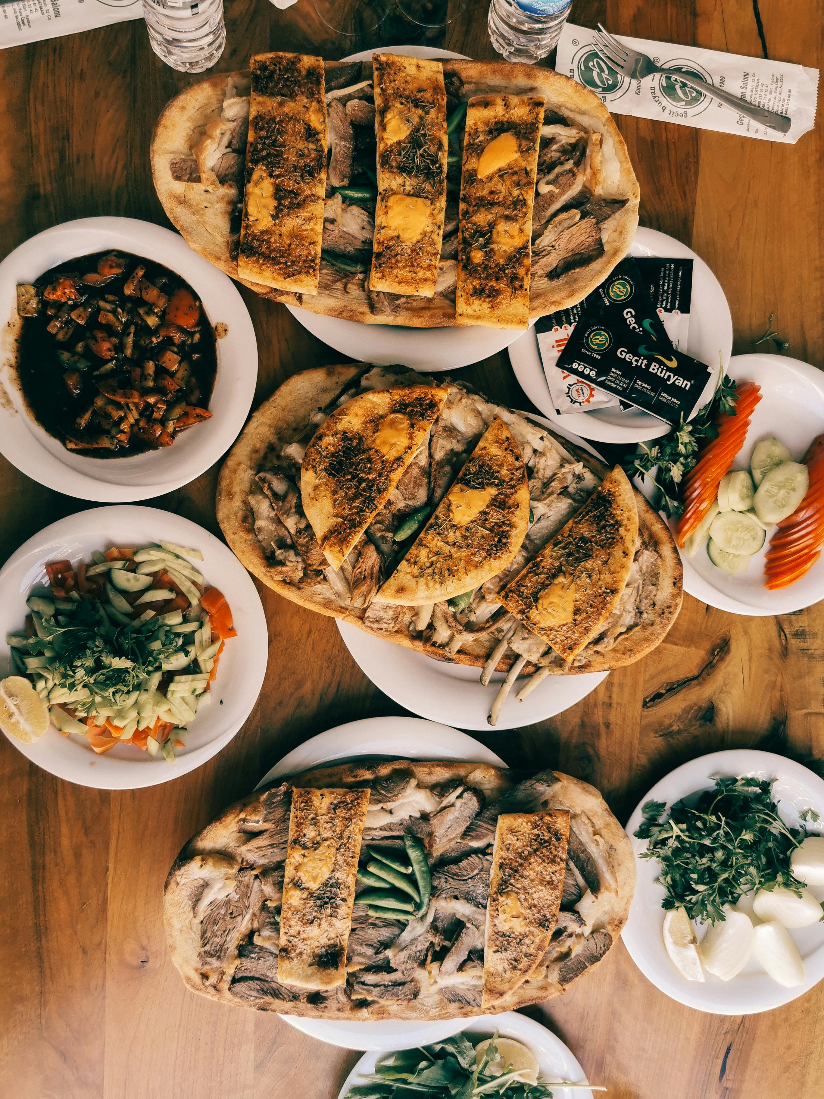 Traditional Meal in a Wooden Table · Free Stock Photo