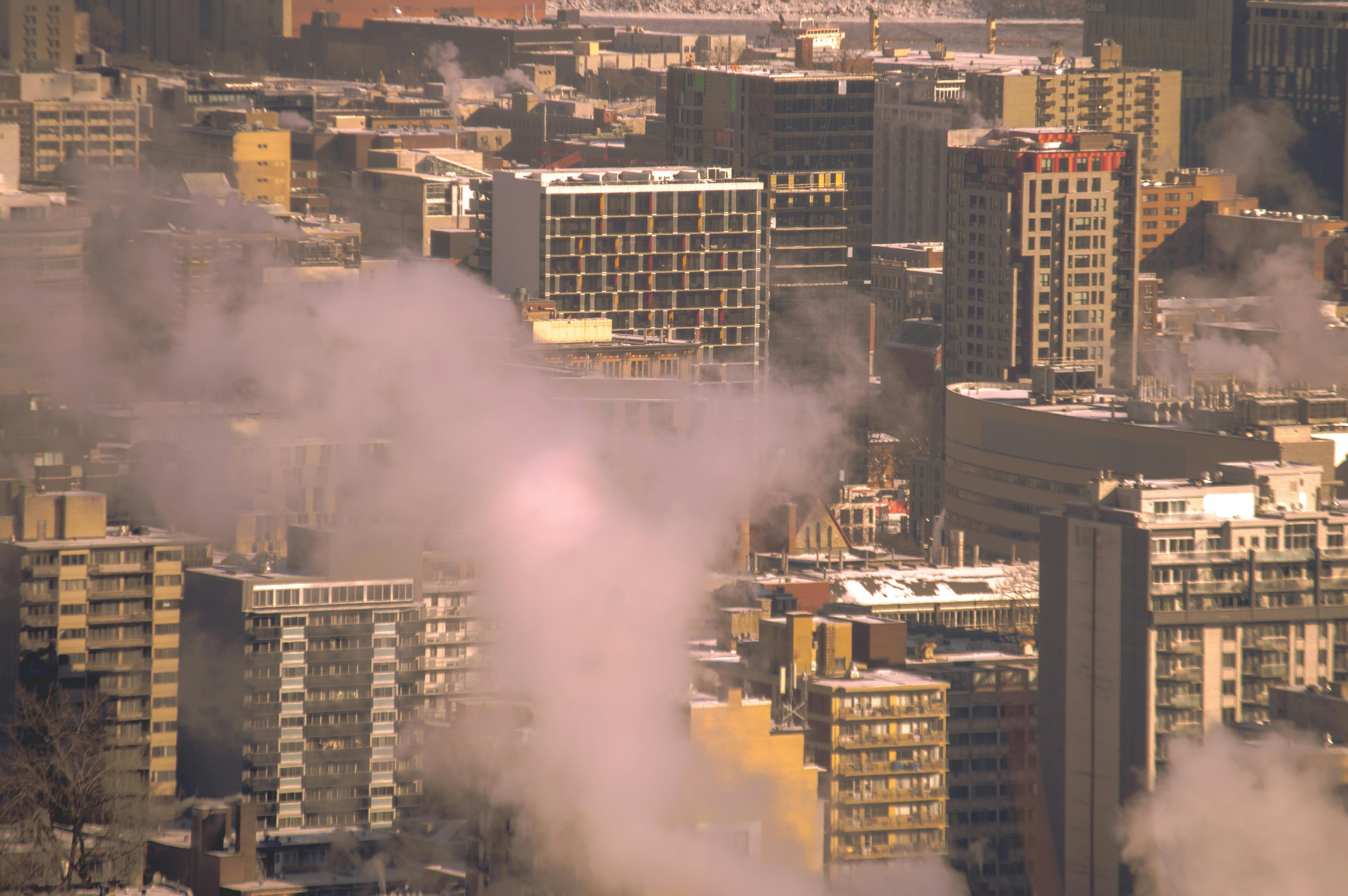 White Smoke Over the Buildings in the City · Free Stock Photo
