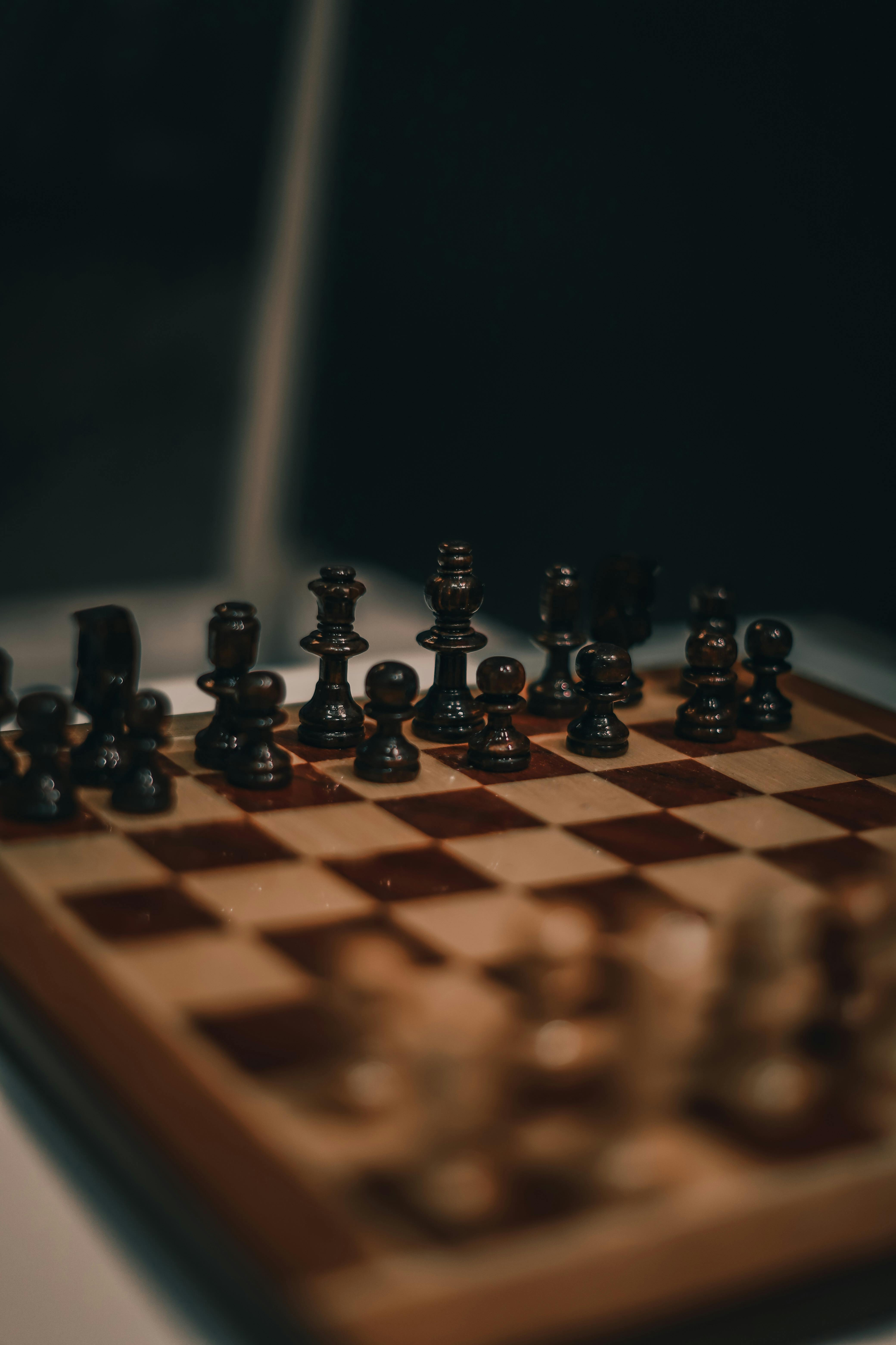 Chessboard on Green Surface · Free Stock Photo