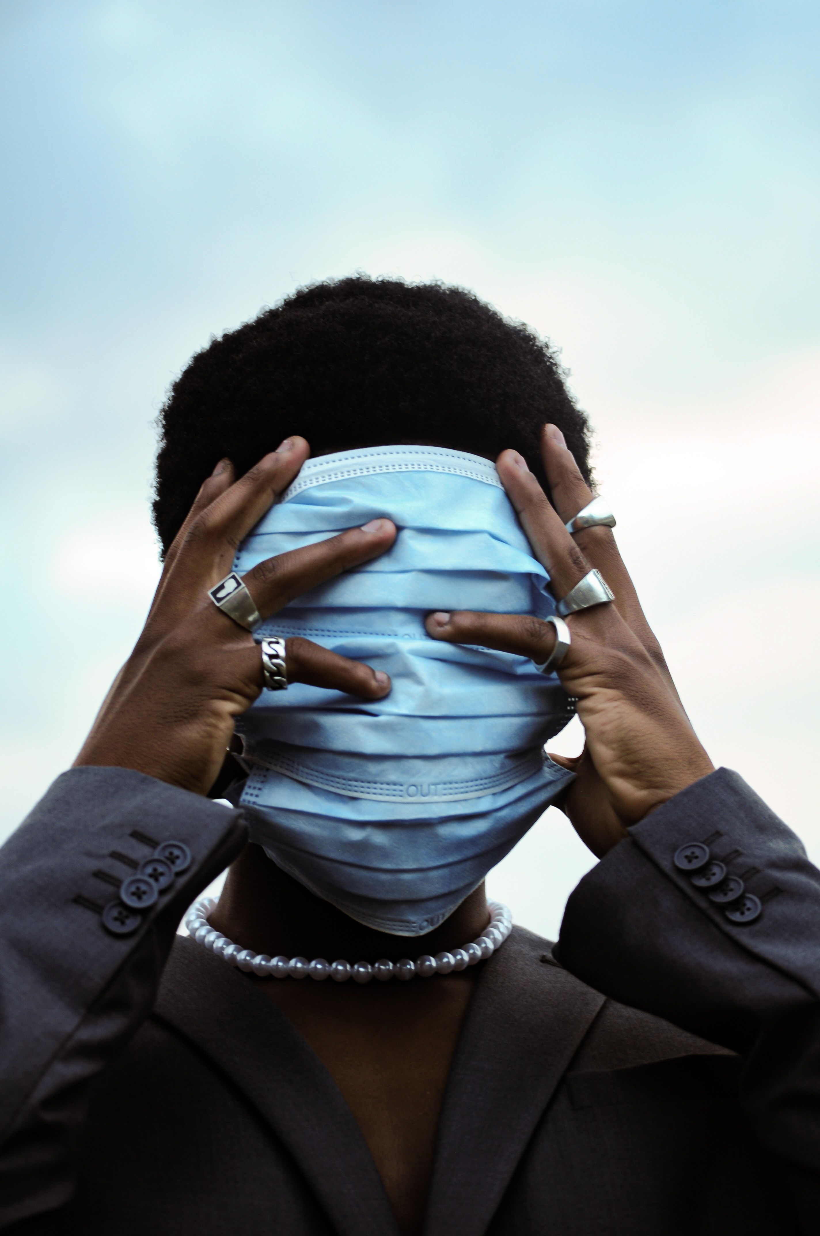 Man in Black Coat Wearing Blue Mask Covering His Face · Free Stock Photo
