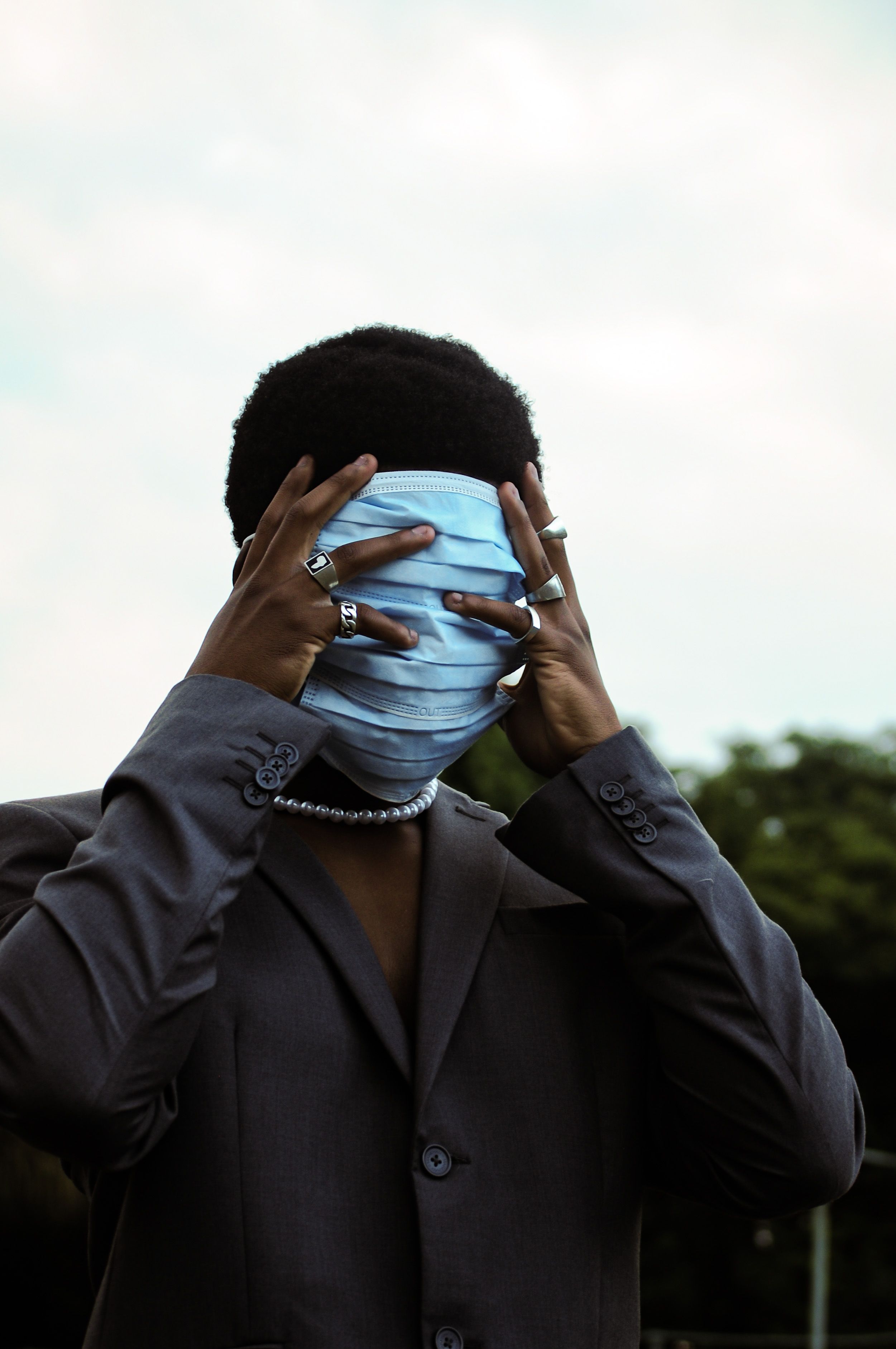 Man in Black Coat Wearing Blue Mask Covering His Face · Free Stock Photo