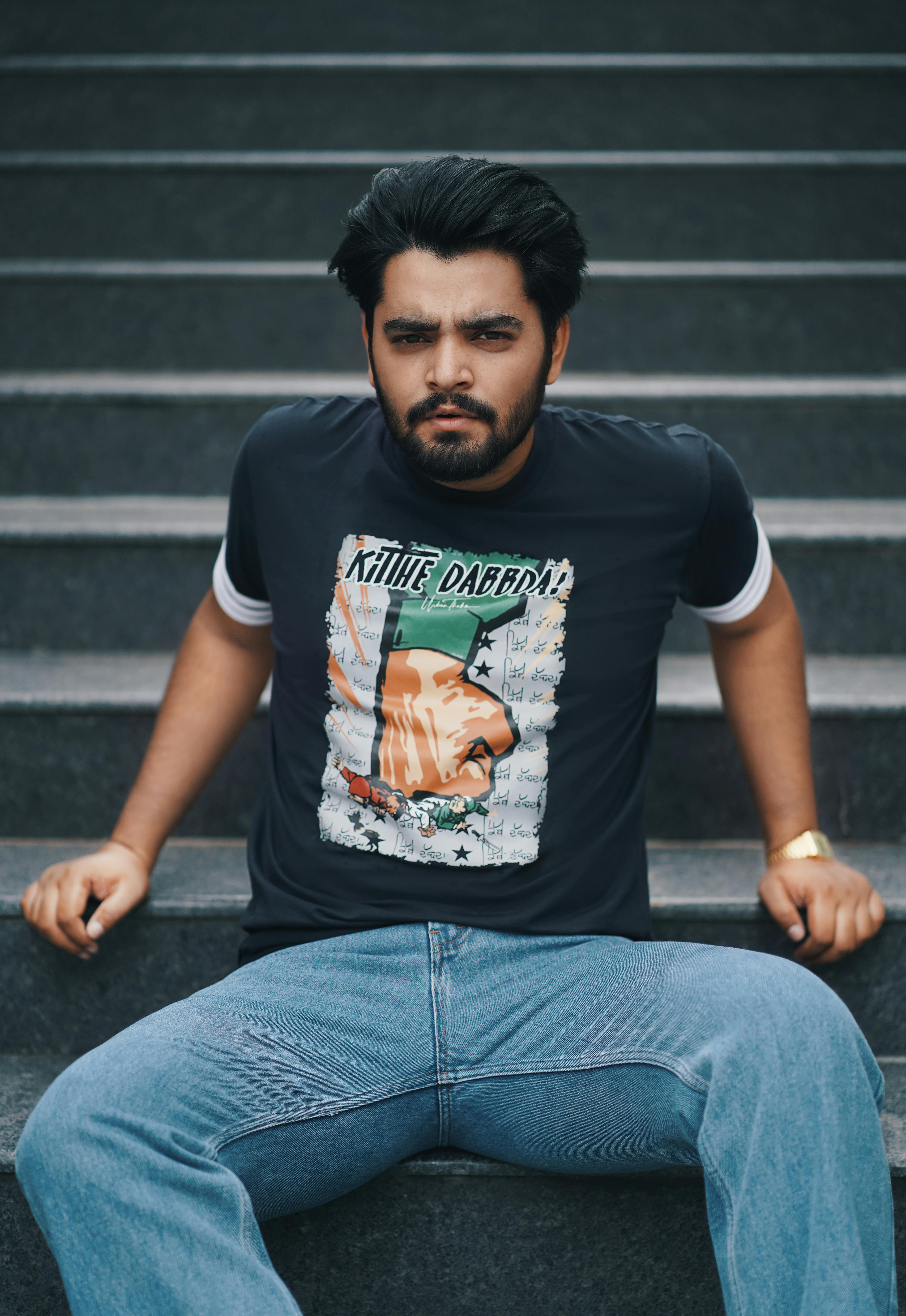 Man Sitting on Steps Posing · Free Stock Photo