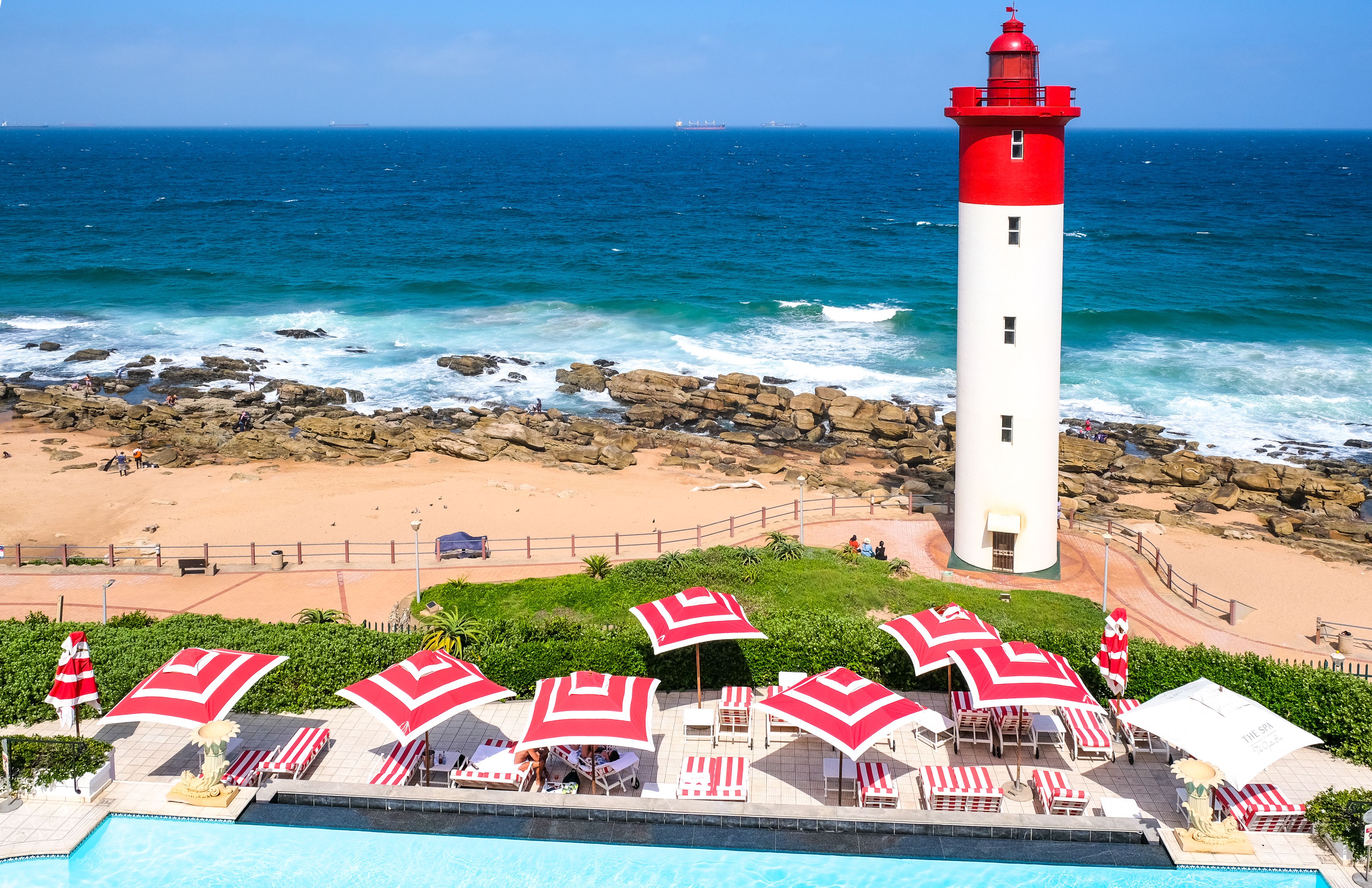 Lighthouse on Shore · Free Stock Photo