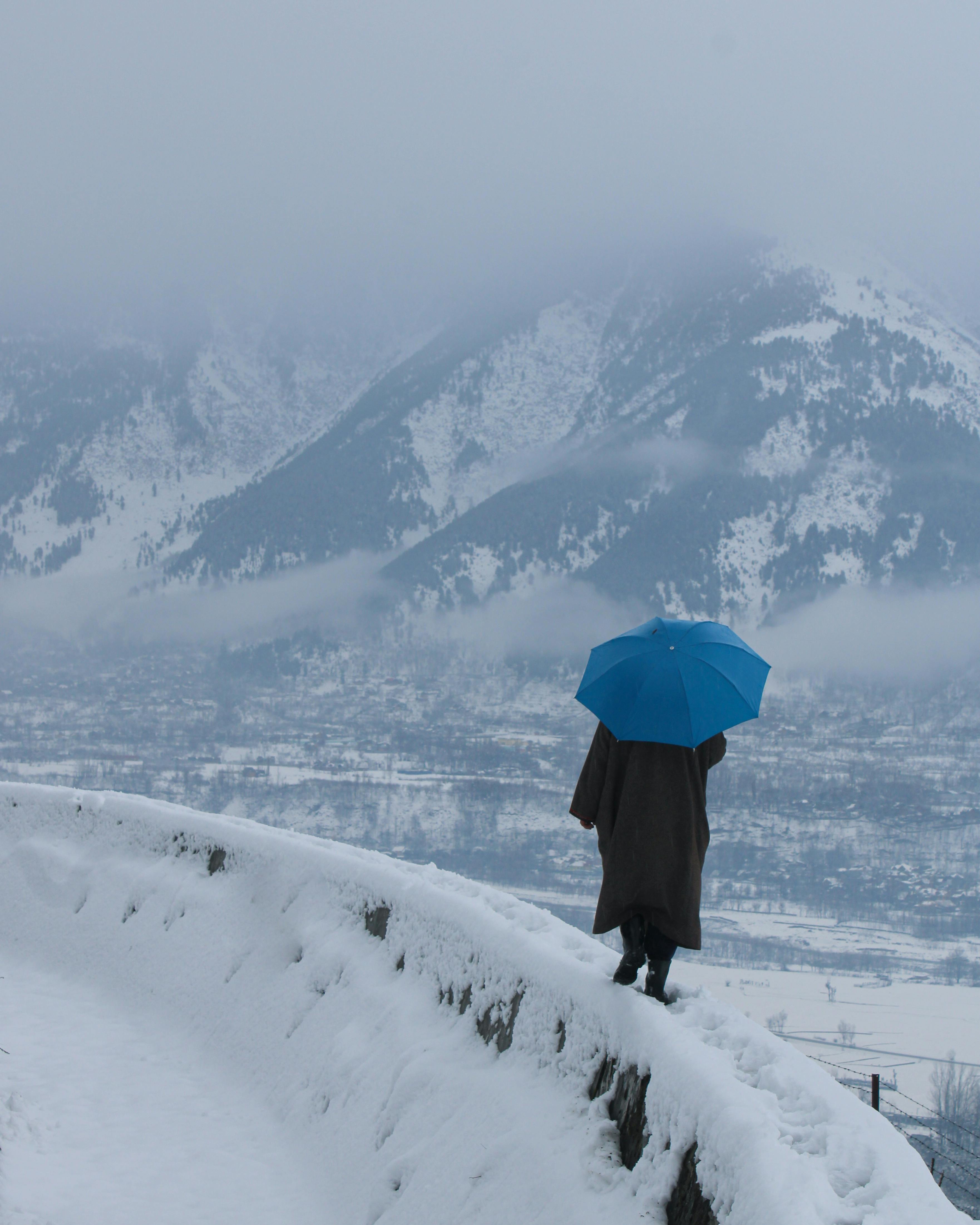 Monocohrome Photo of Person walking on a Snow-Covered Cliff · Free ...