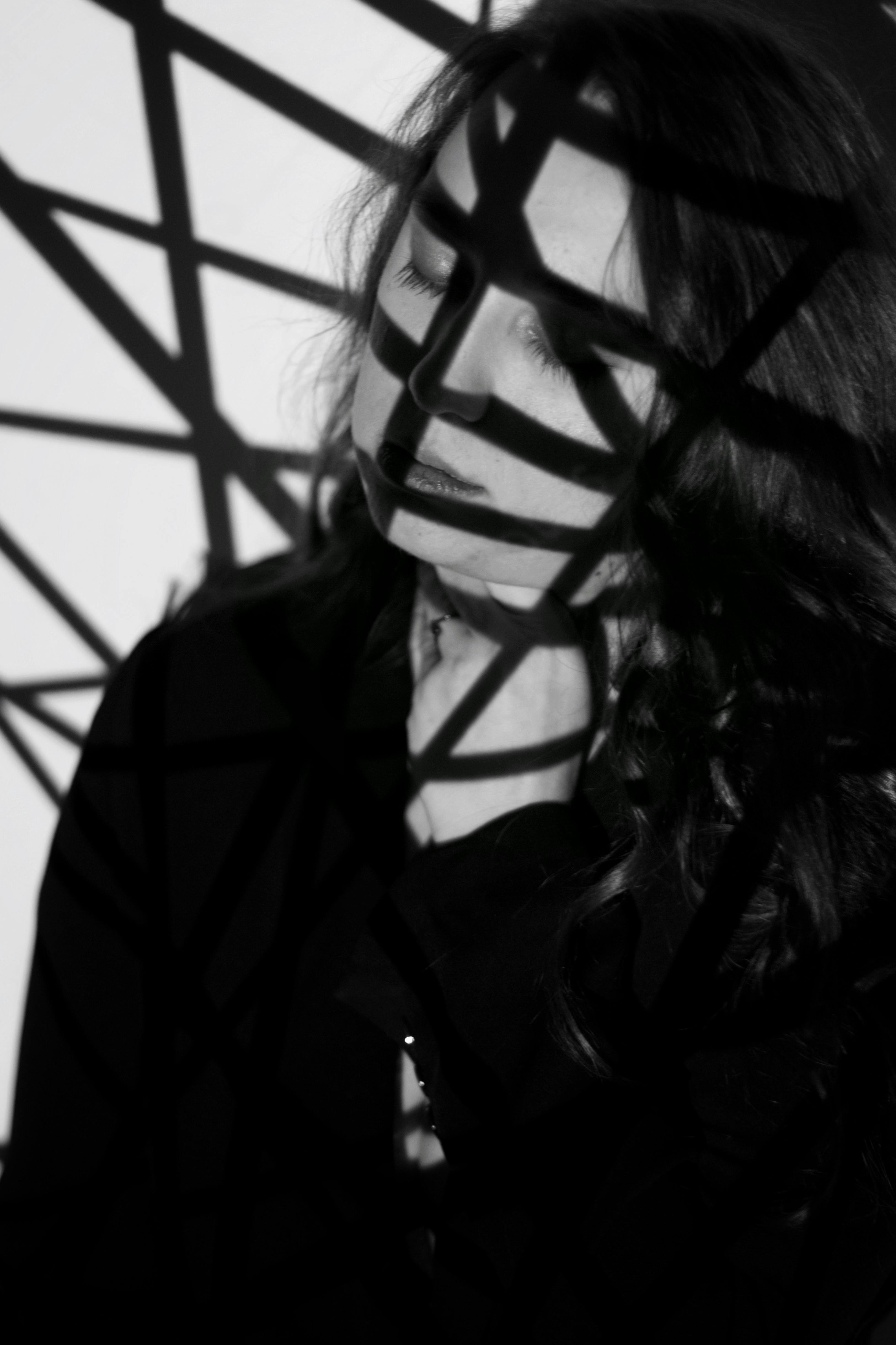 Shadow Overlaying Woman's Face · Free Stock Photo