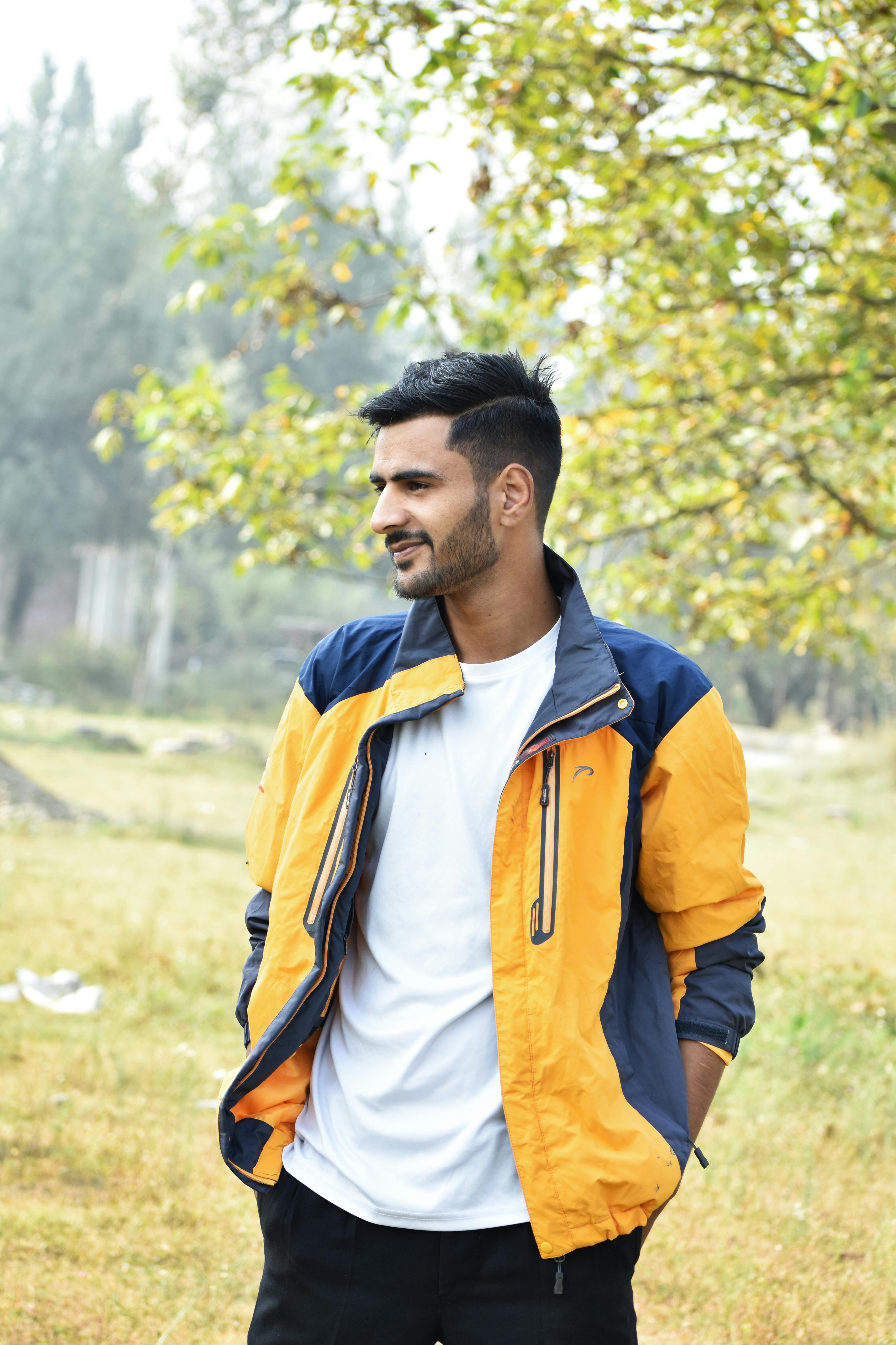 A Man Smiling while Looking Down · Free Stock Photo