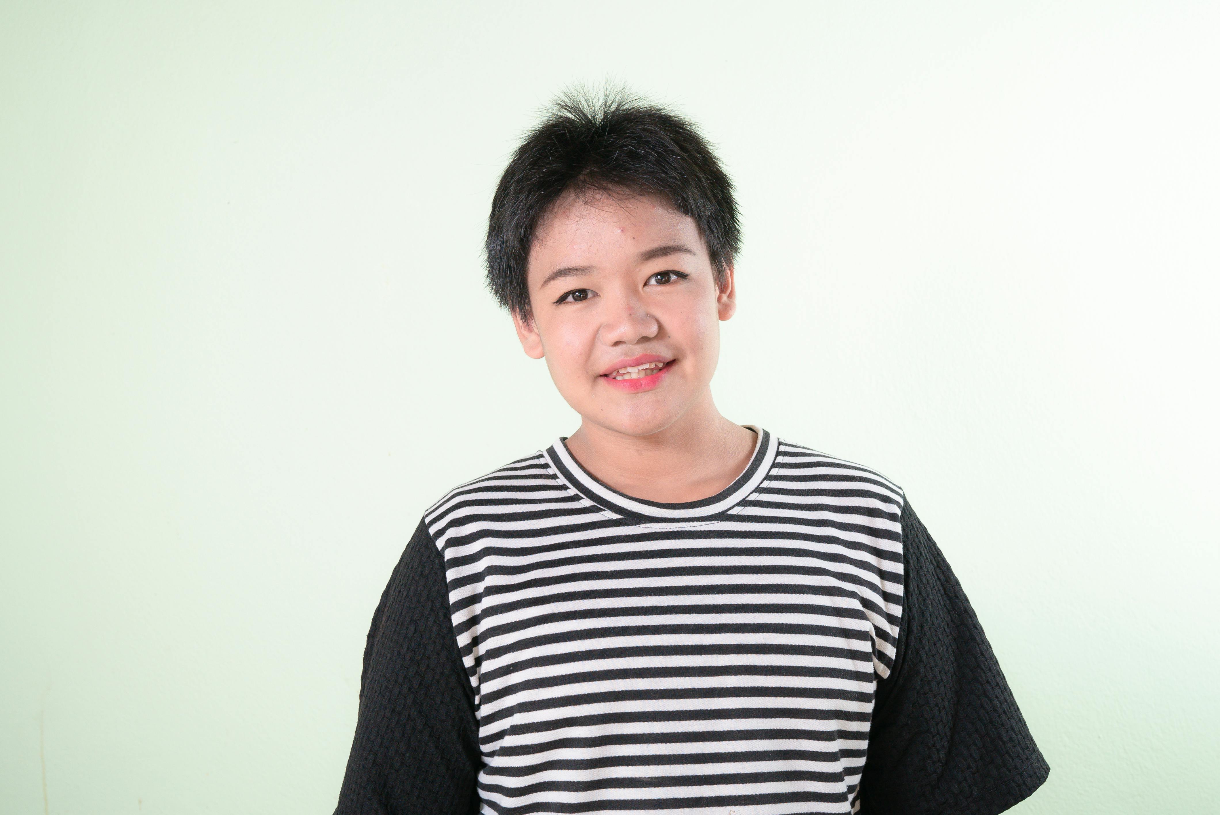 A Young Woman Biting Her Index Finger with a Shut Up Note · Free Stock ...