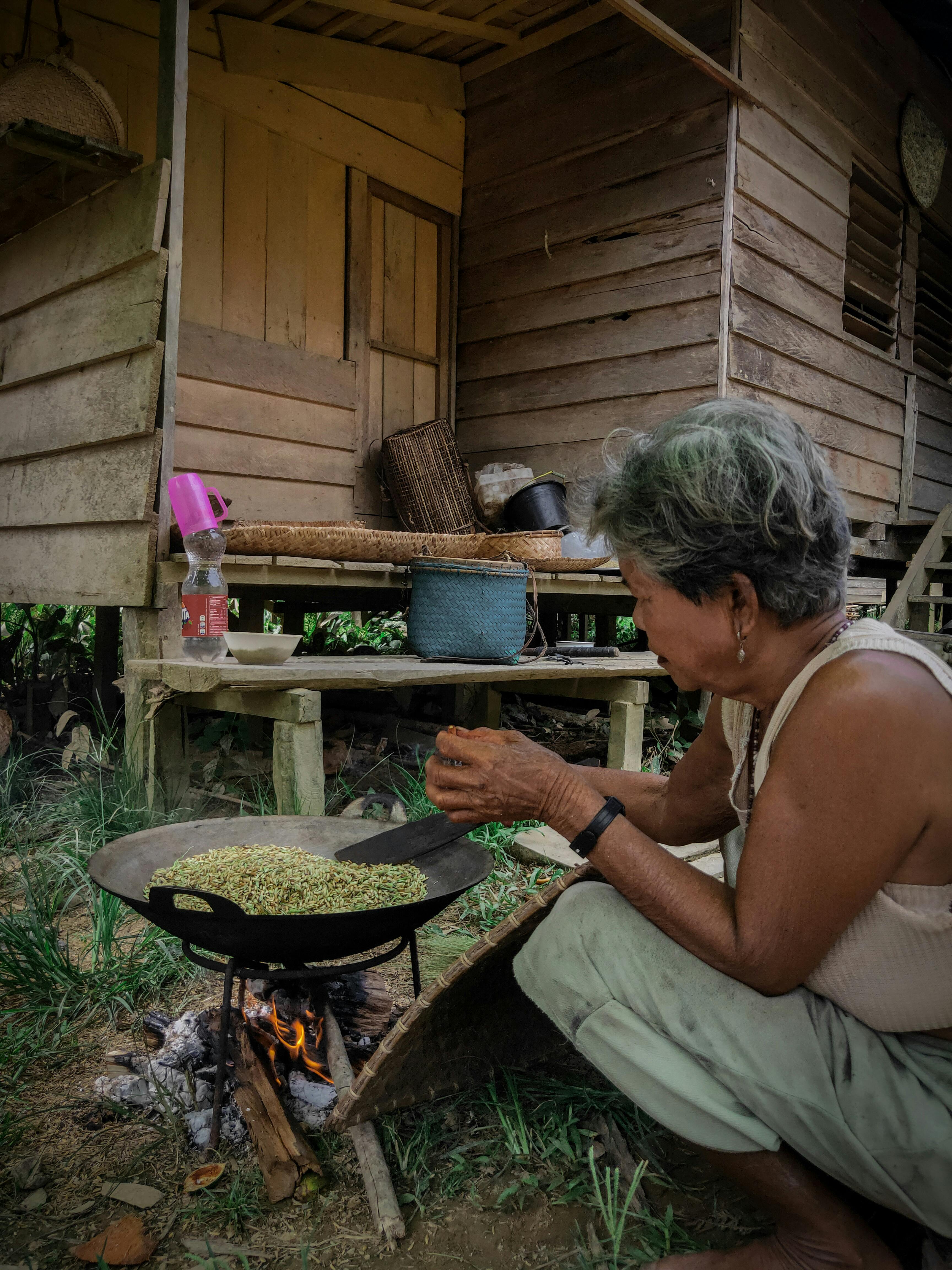 Woman Cooking Outside · Free Stock Photo