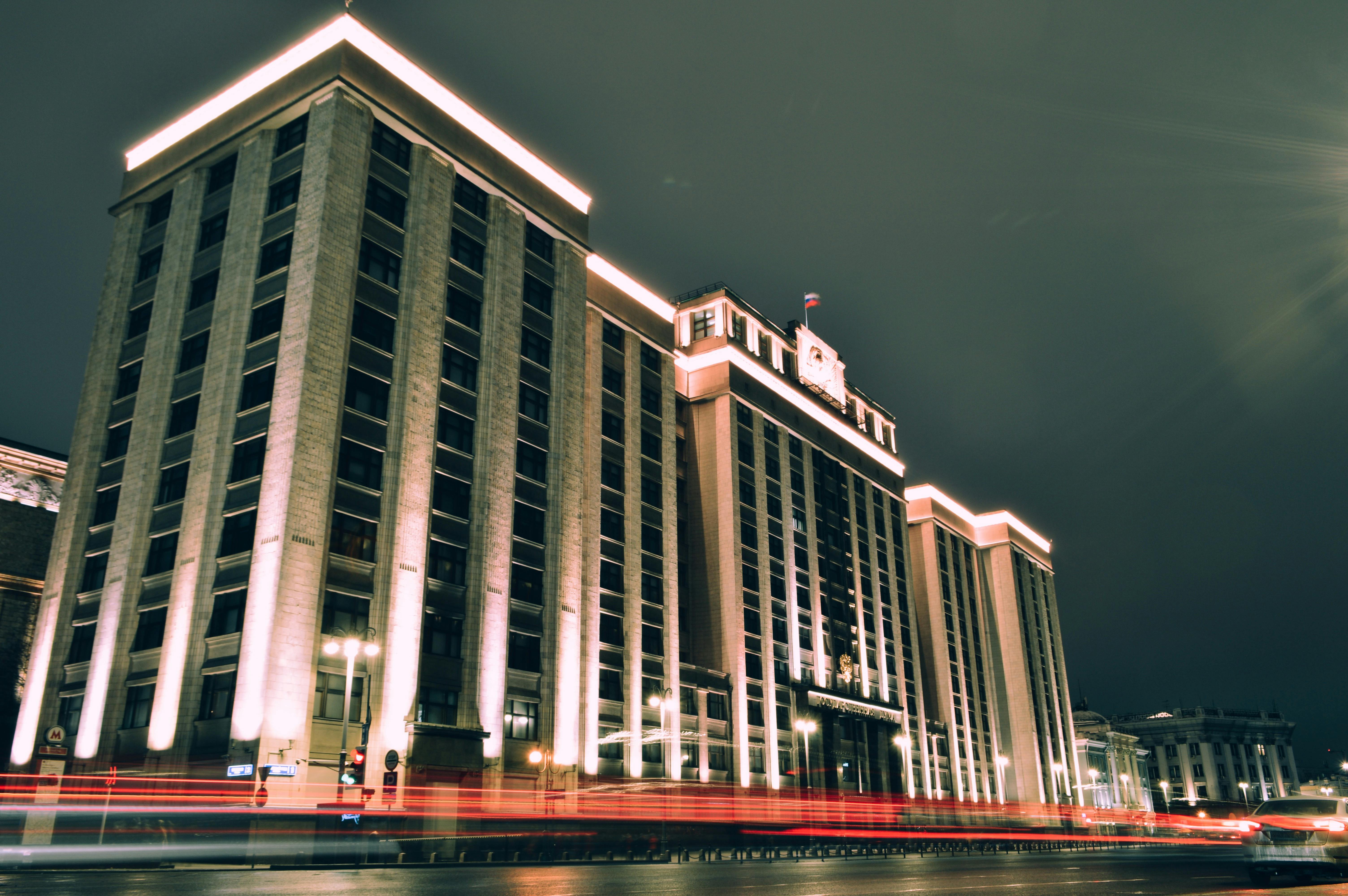 Black Building Lighted Under Clear Sky · Free Stock Photo
