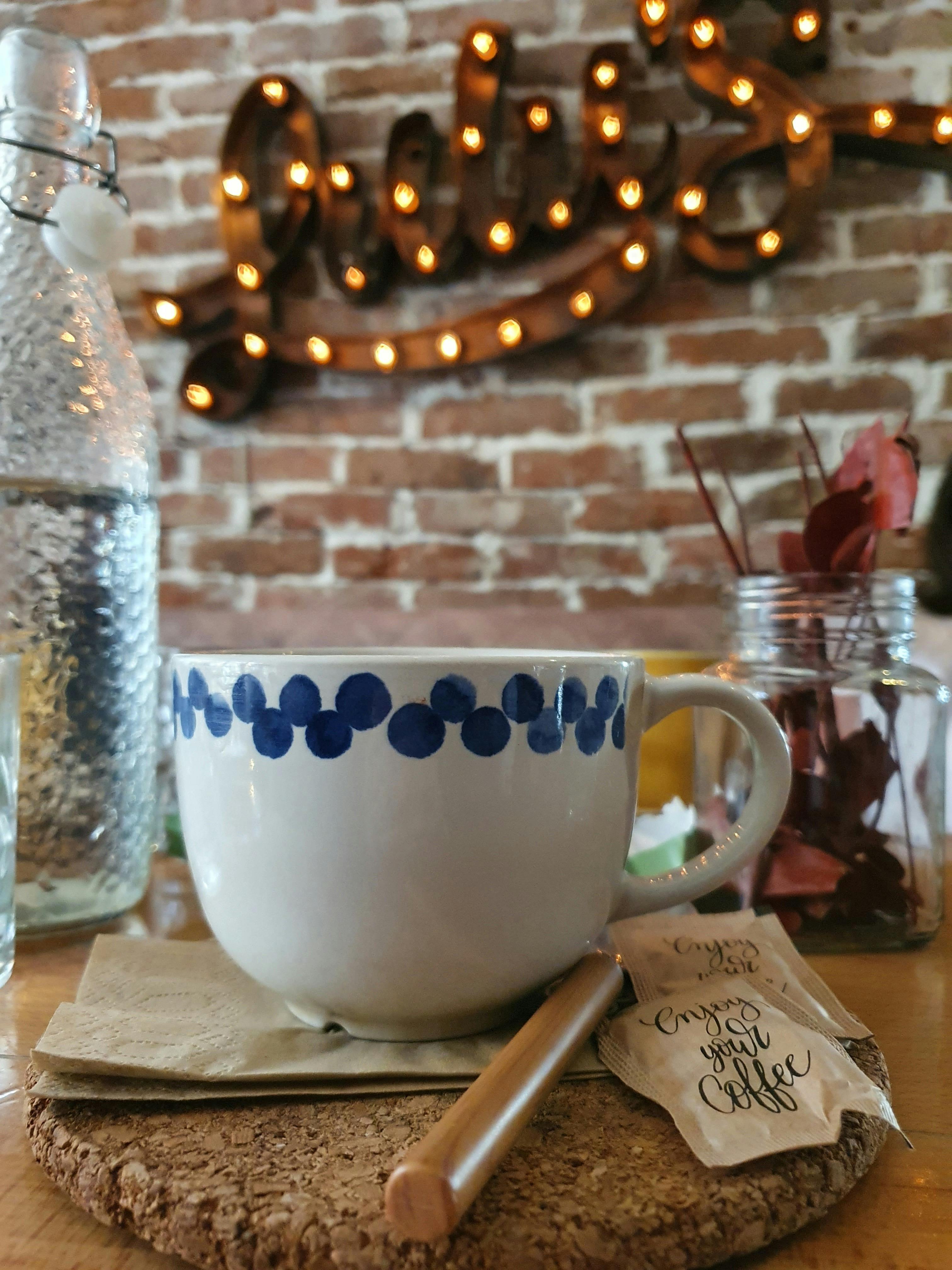 A Cup of Coffee on a Table · Free Stock Photo