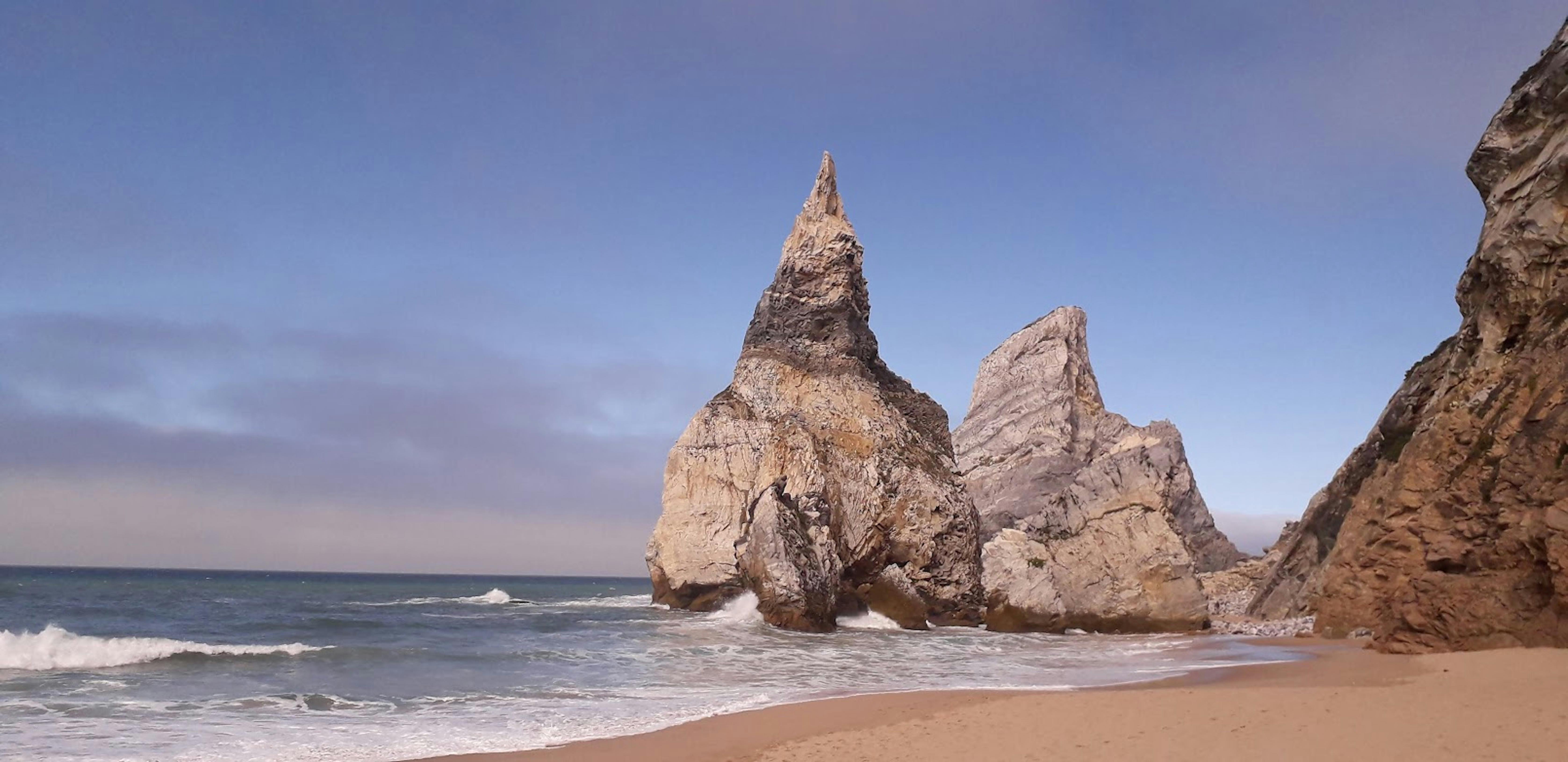 Beautiful Sunset on an Ocean Coast with Rock Formations · Free Stock Photo