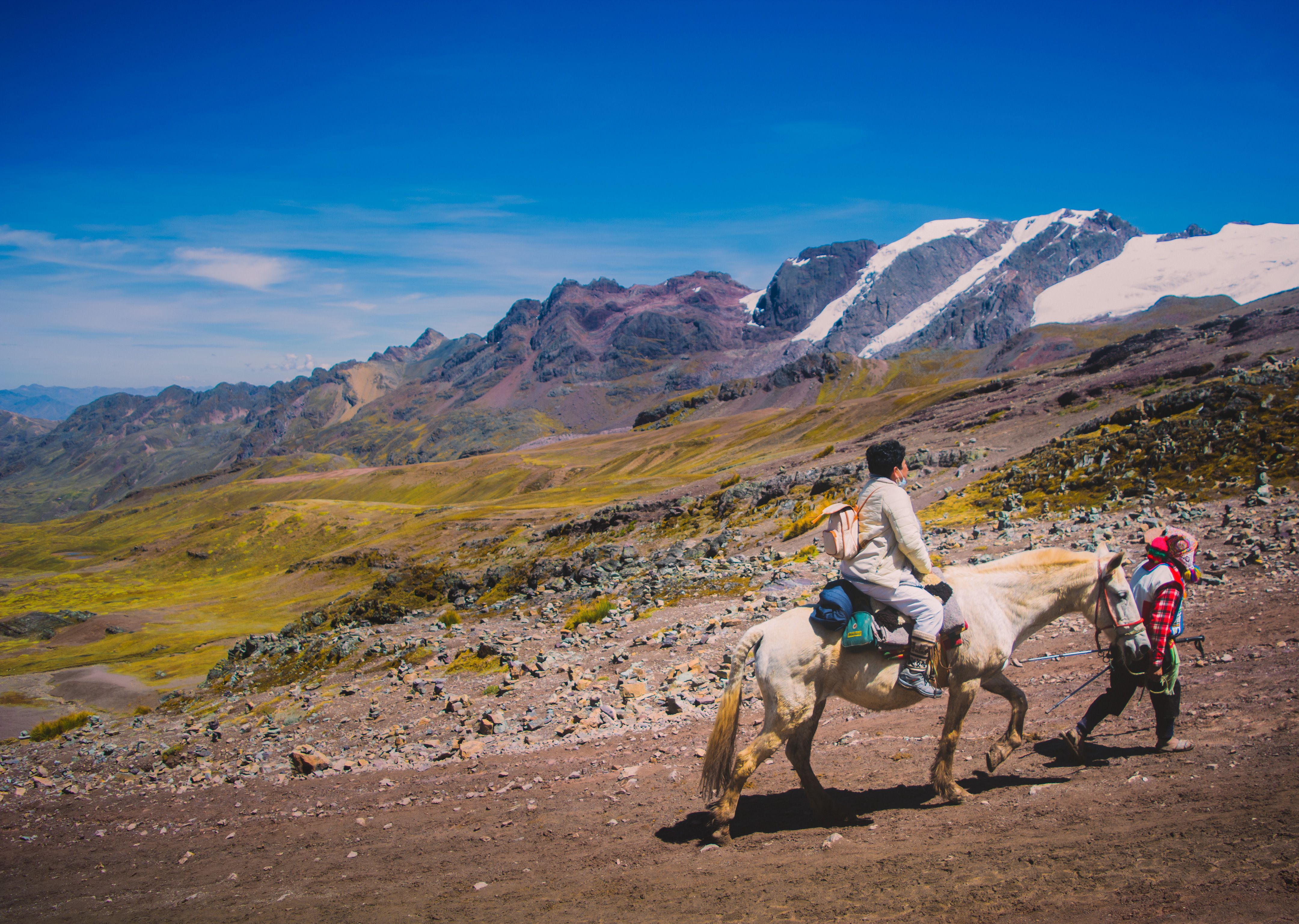 Person riding Horse in a Mountain Slope · Free Stock Photo