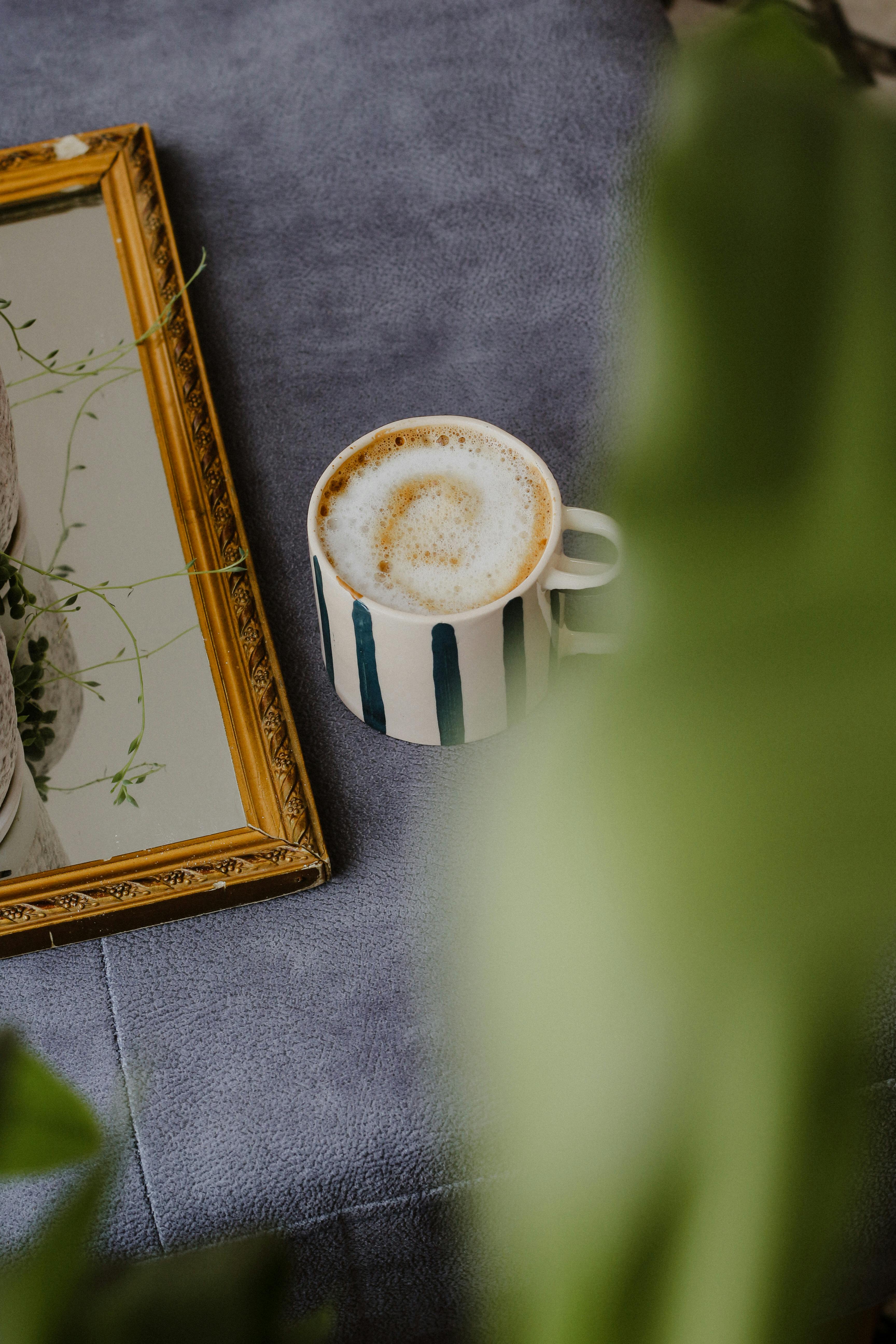 Coffee Cup near Frame · Free Stock Photo