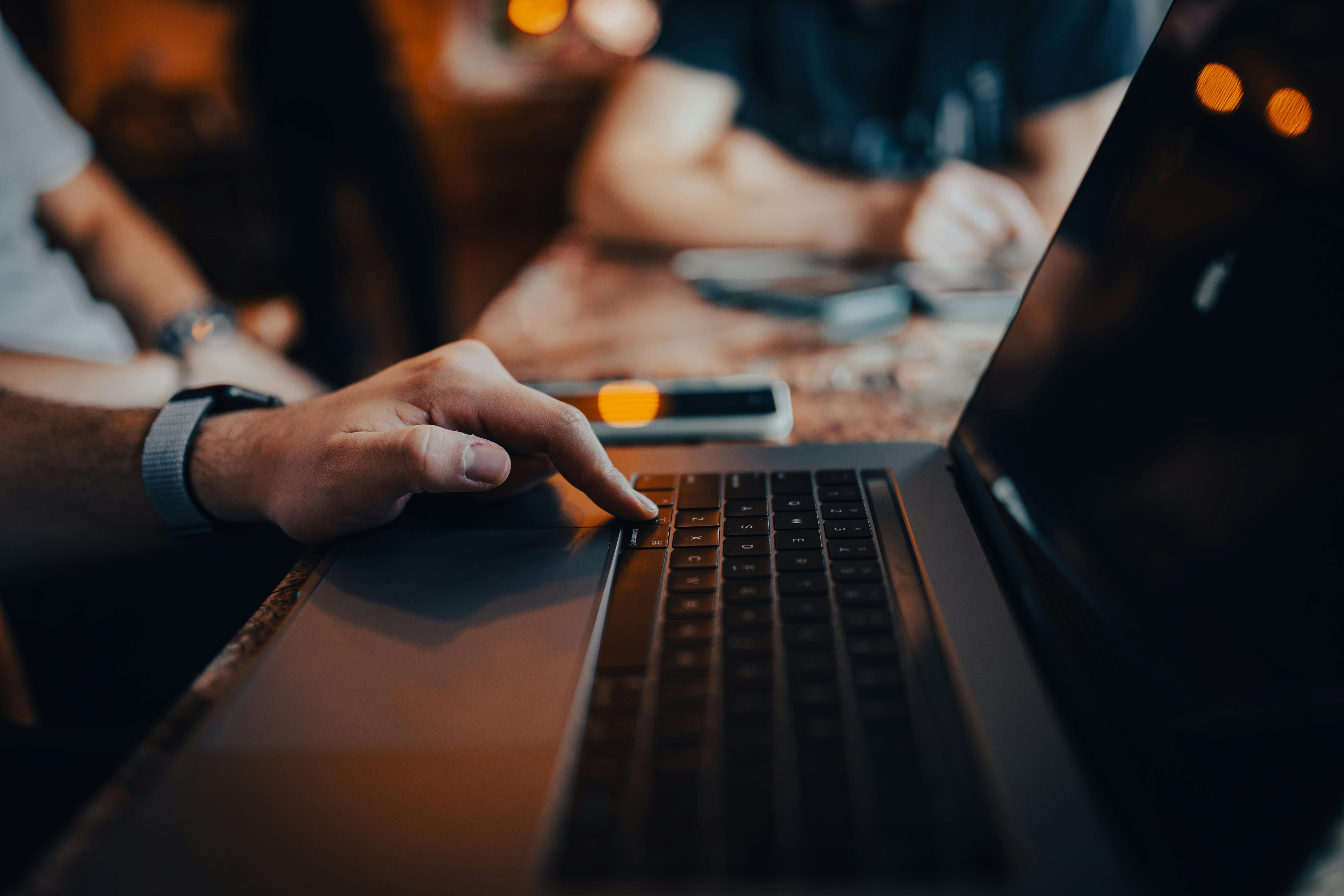 Hand Clicking on Laptop Keyboard · Free Stock Photo