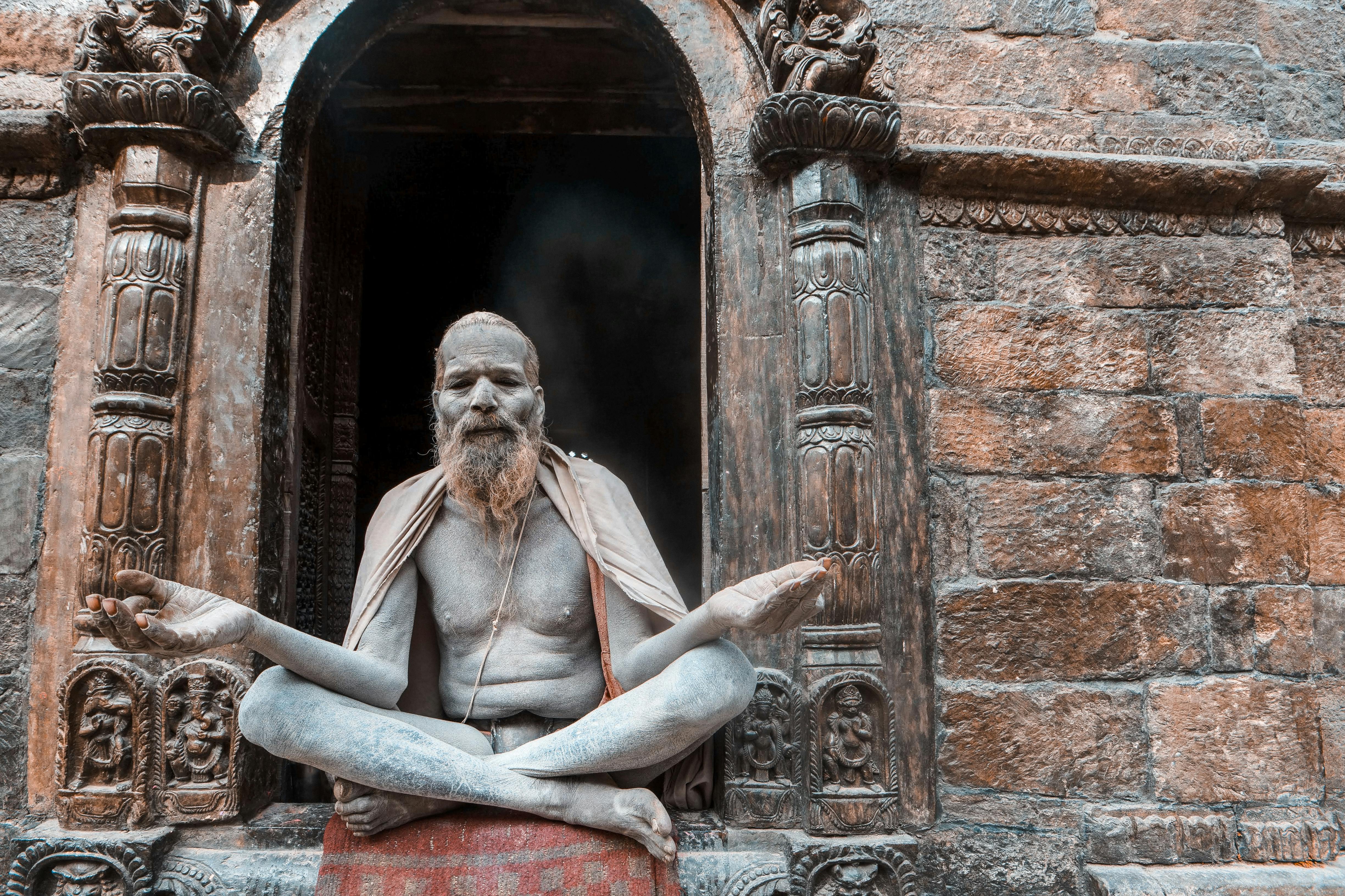 A Monk Sitting Cross-Legged · Free Stock Photo