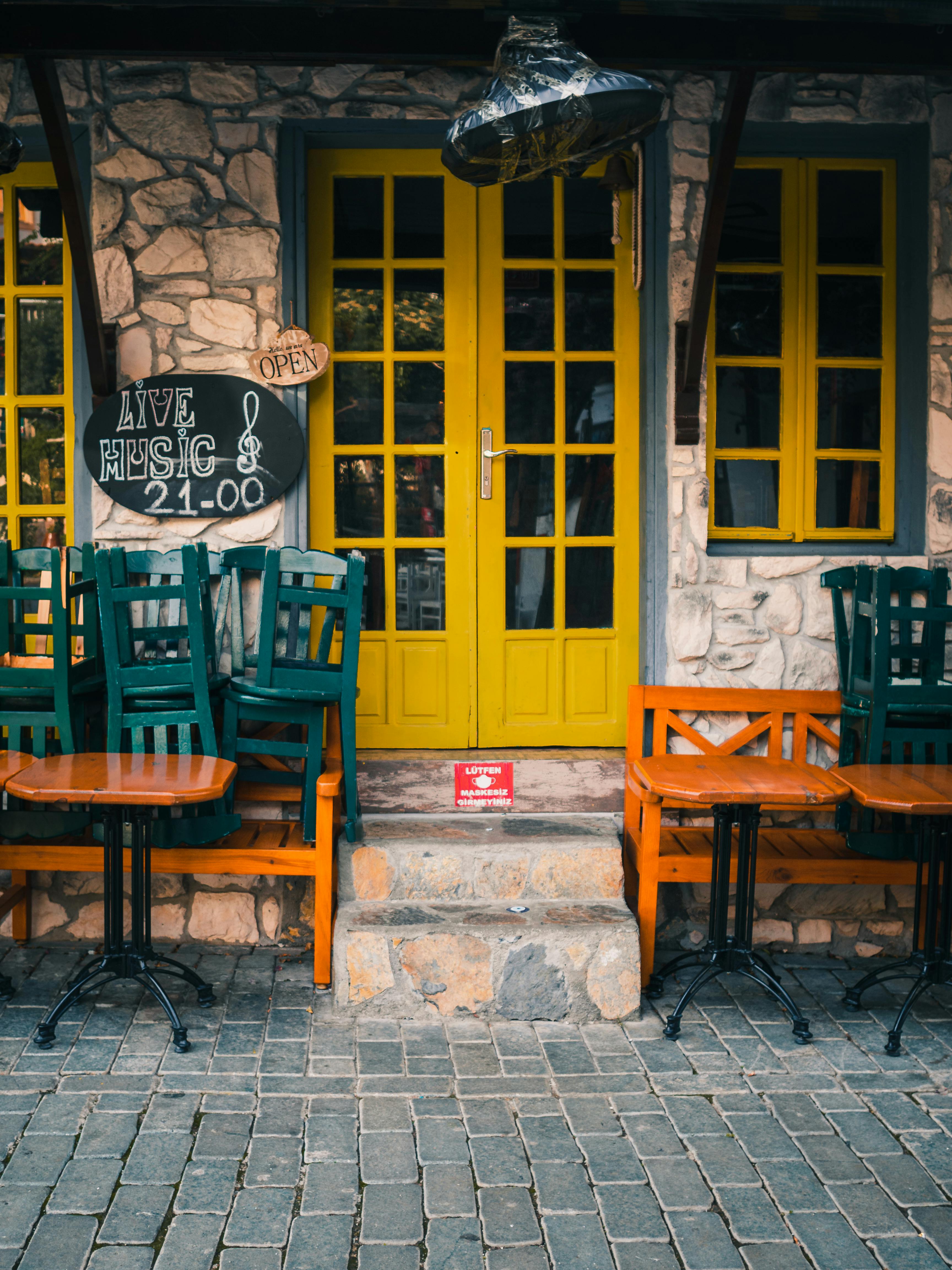 Yellow and Black Trash Bin Beside Staircase · Free Stock Photo