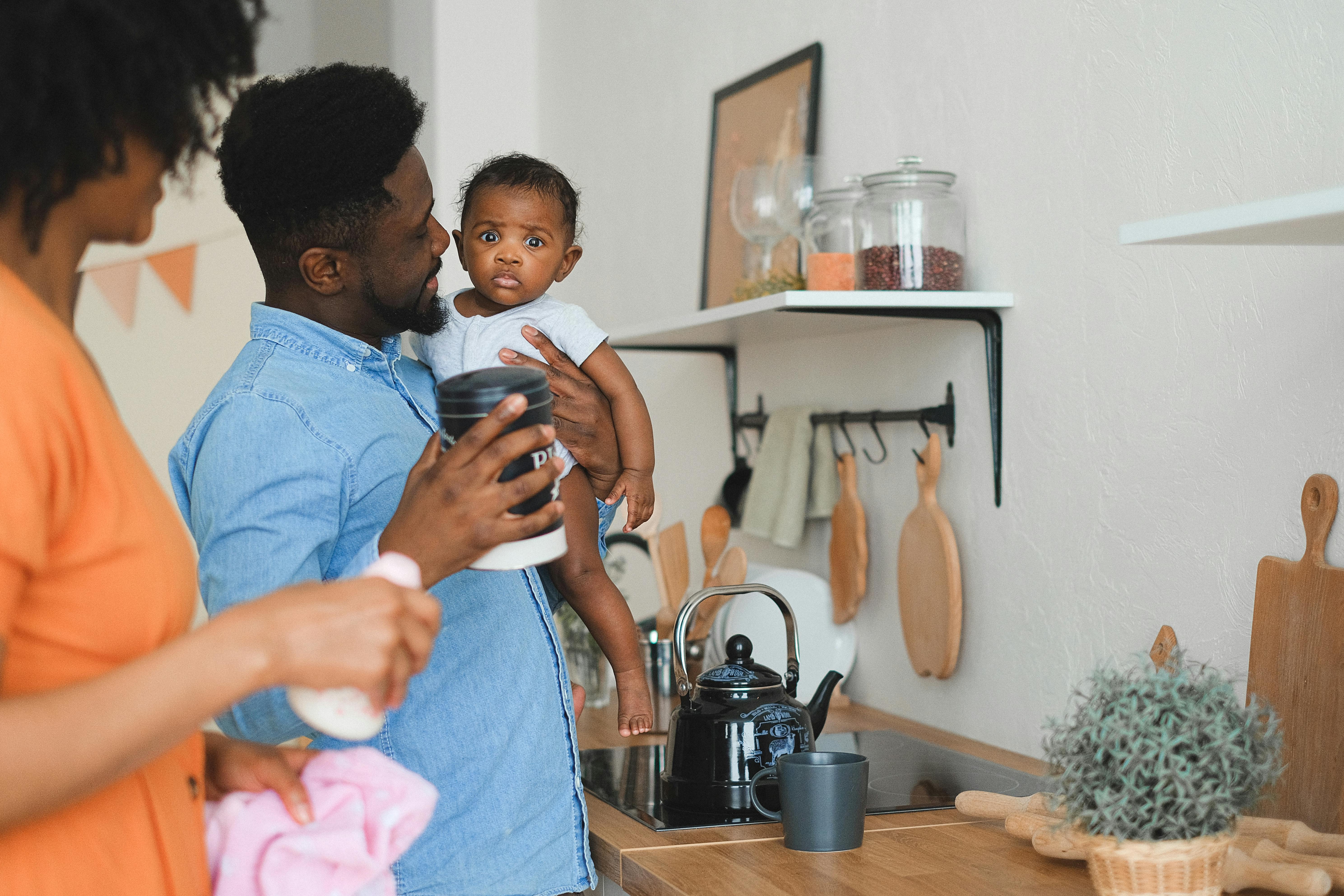 Parents with Baby in Kitchen · Free Stock Photo