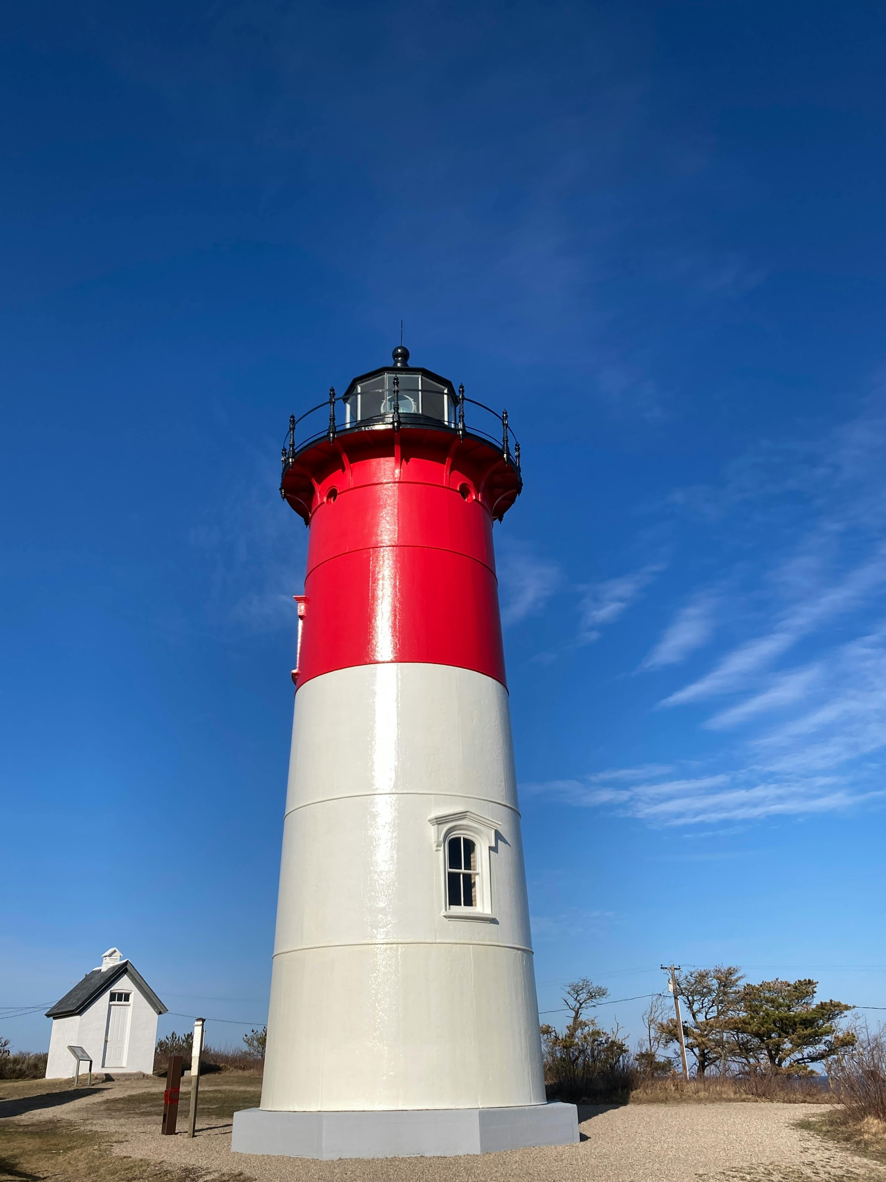 A White and Red Lighthouse · Free Stock Photo