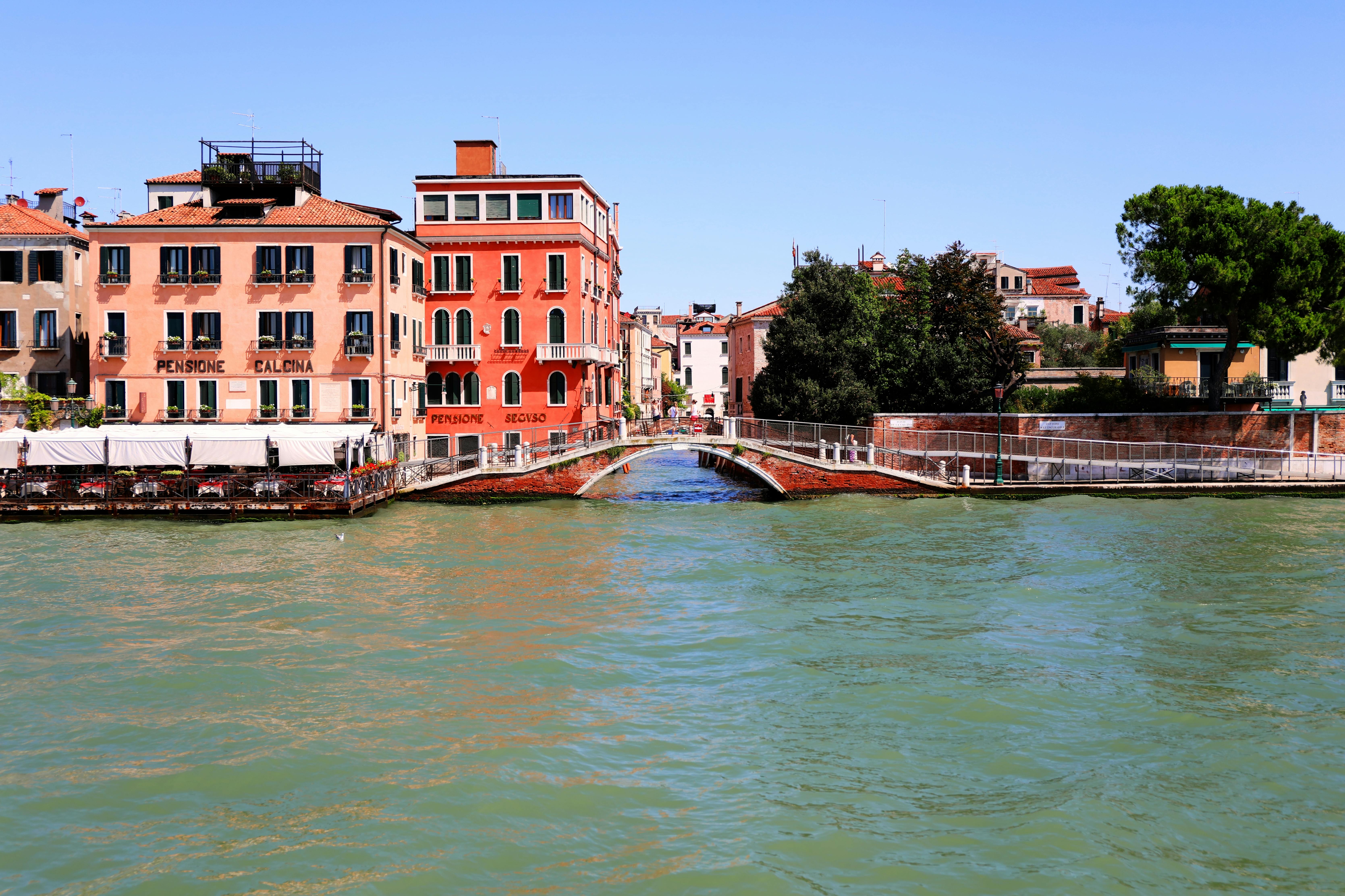 Concrete Buildings near a Body of Water · Free Stock Photo
