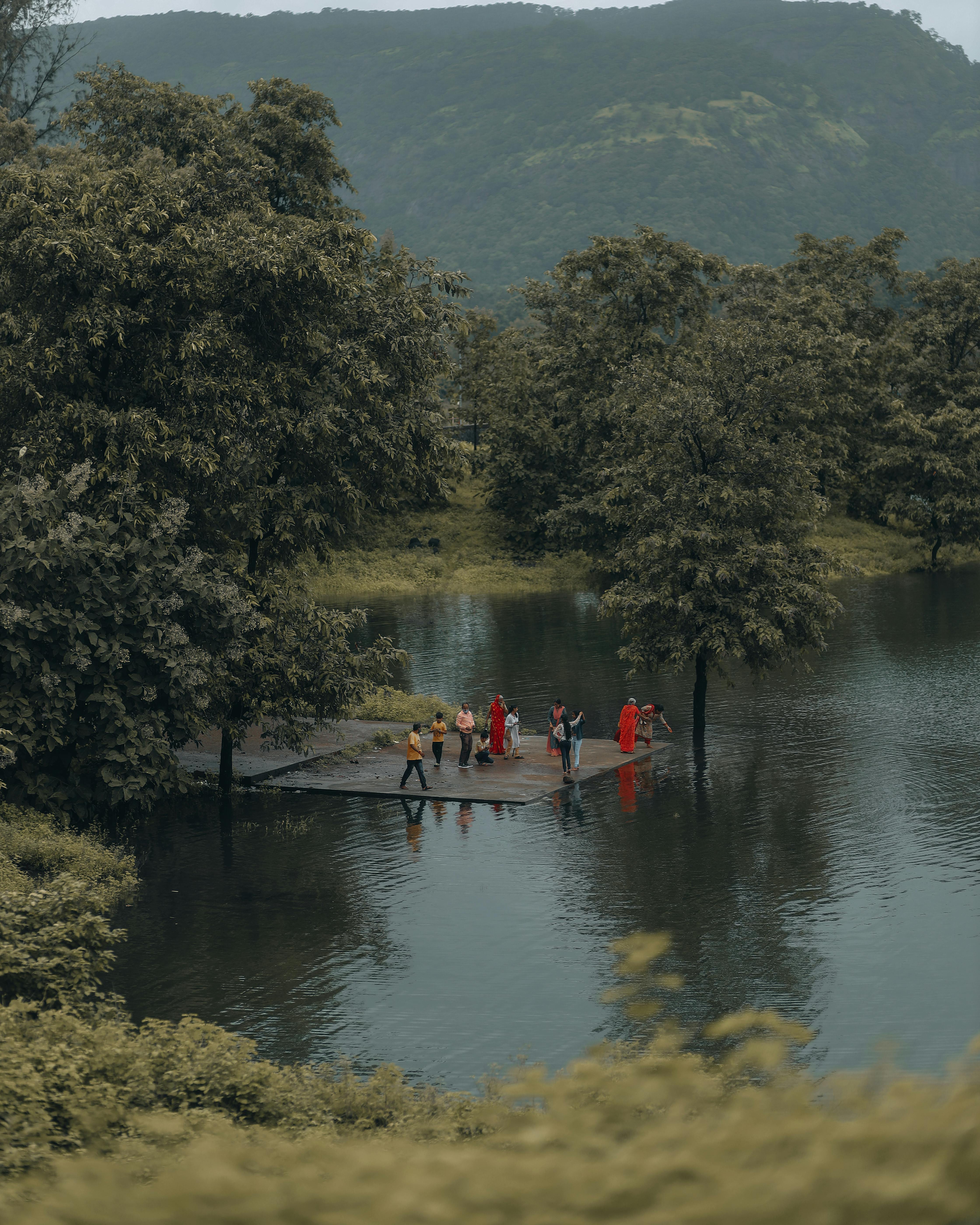 Aerial View of People on the Lake Shore · Free Stock Photo