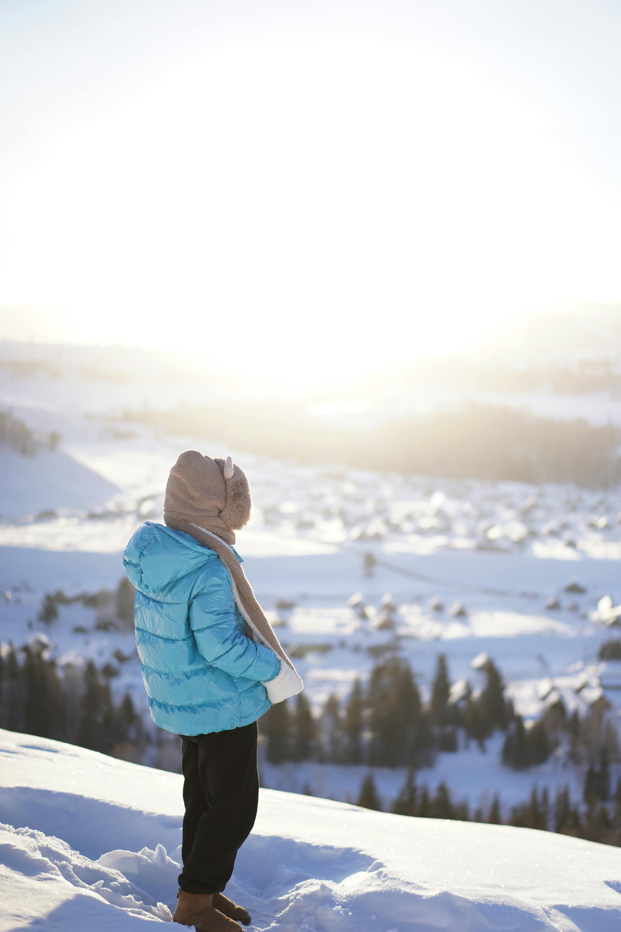A Man and Woman Wearing Winter Clothes Cuddling · Free Stock Photo