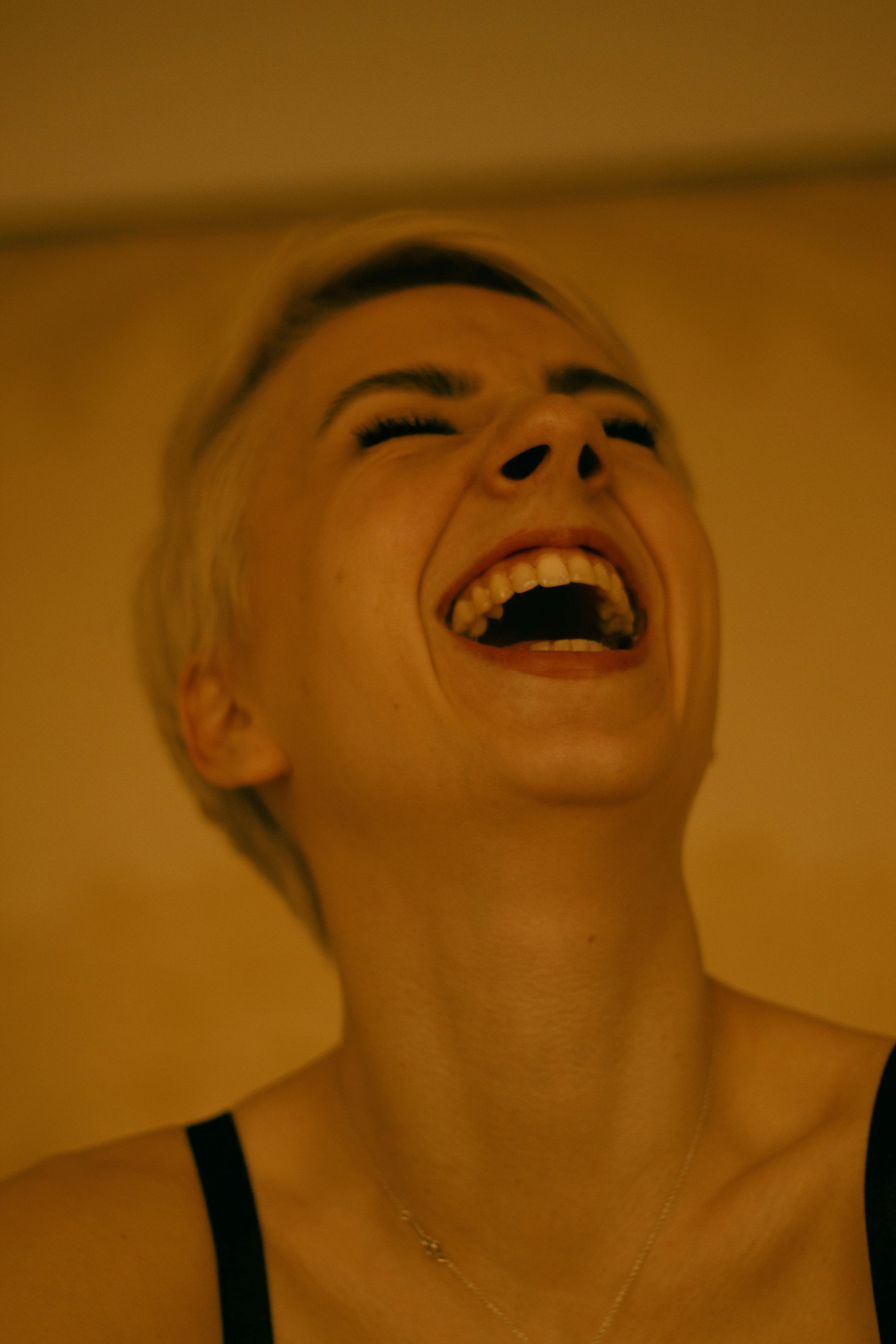 Close Up Photo of Blond Woman Laughing · Free Stock Photo