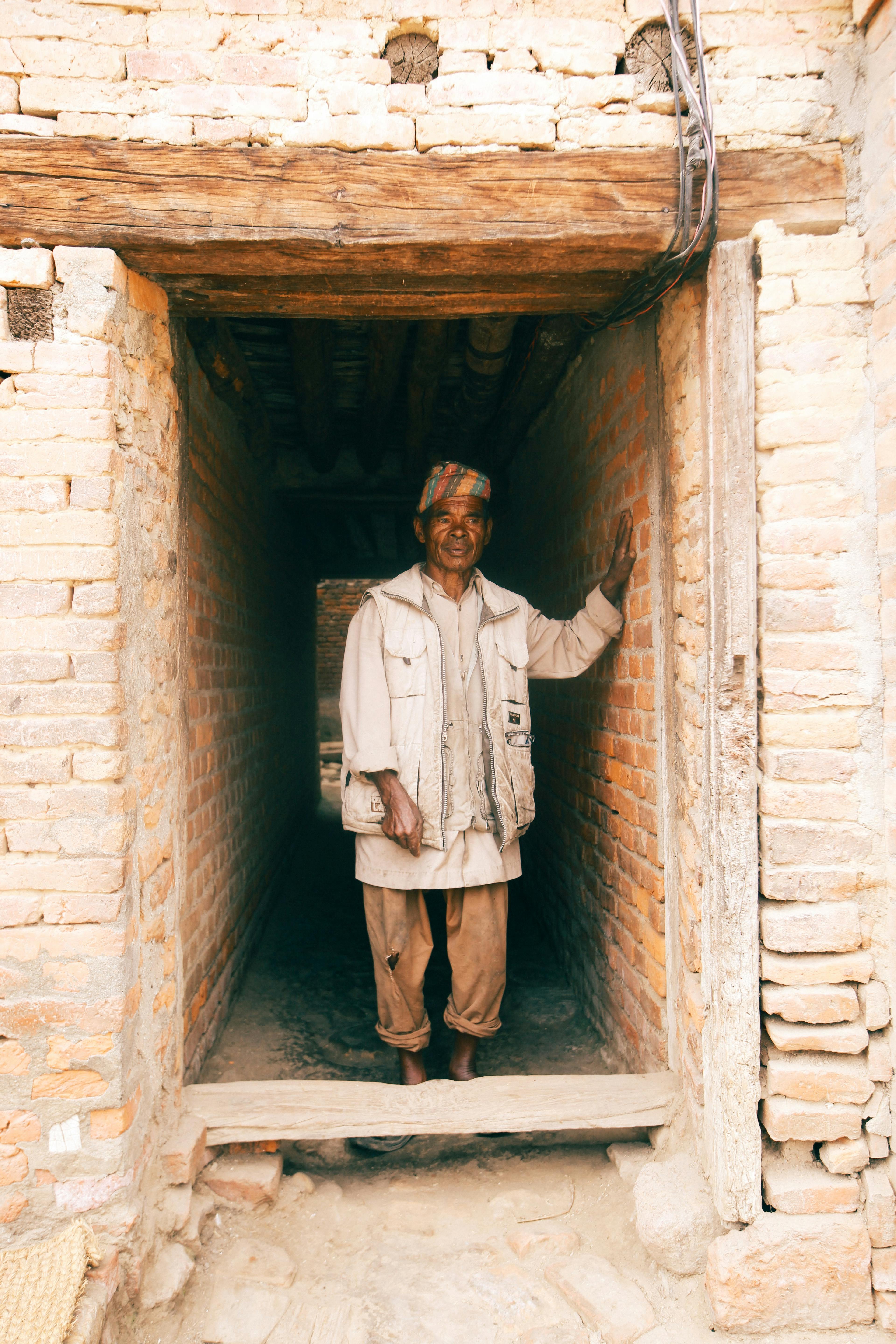 Man in Building Doorway · Free Stock Photo