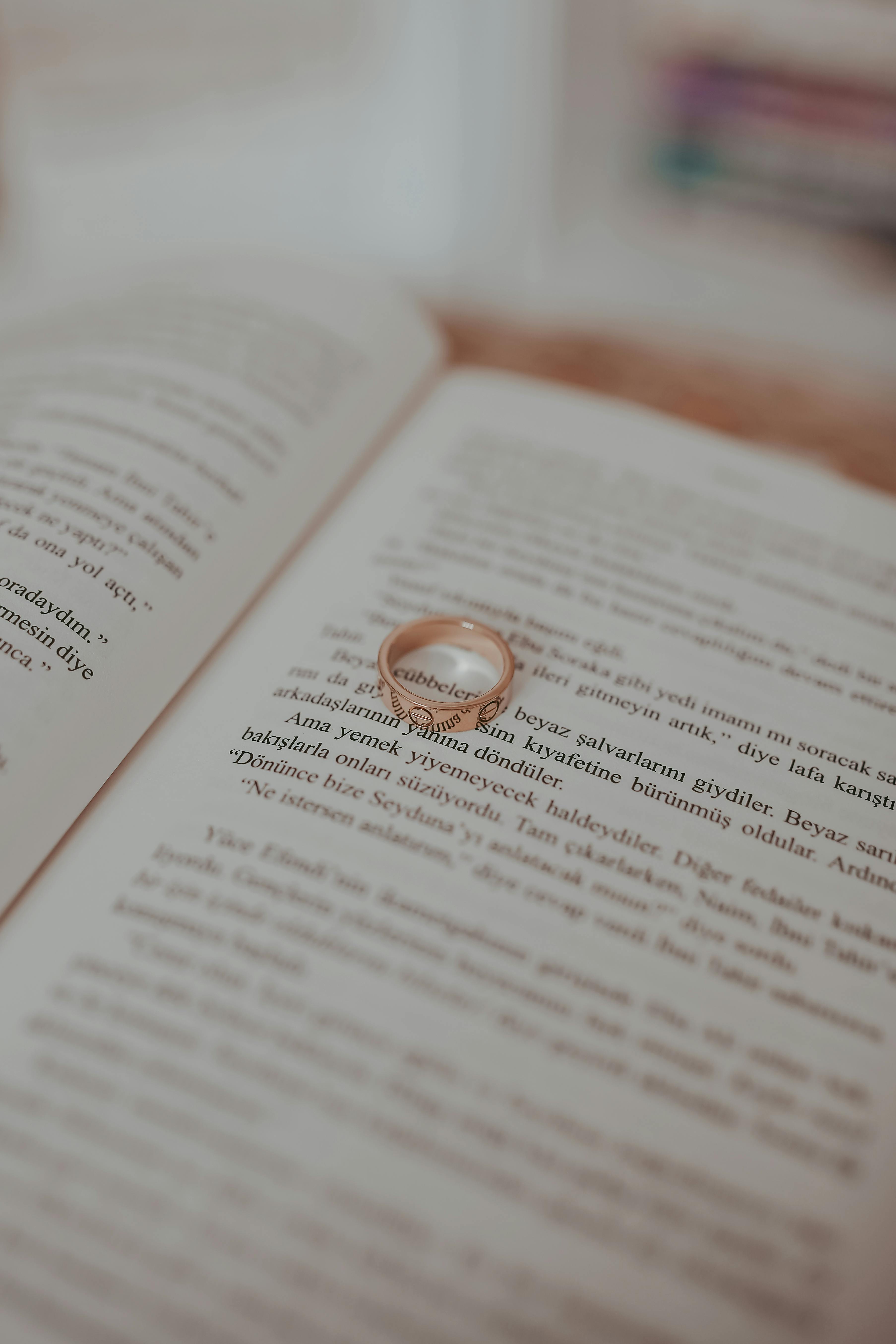 Close Up Photo of Ring on Book Page · Free Stock Photo