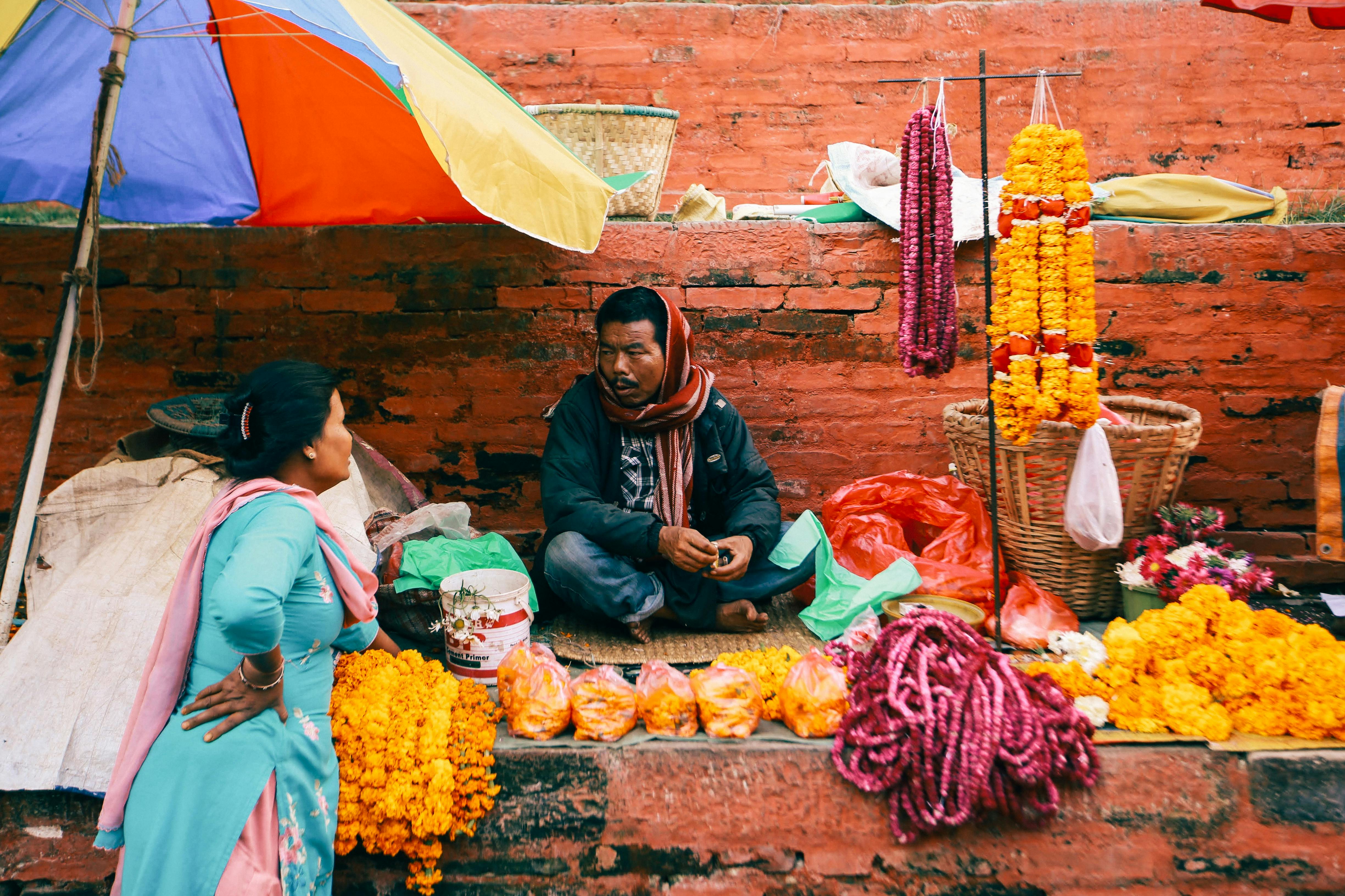 Merchant sitting in a his Stall · Free Stock Photo