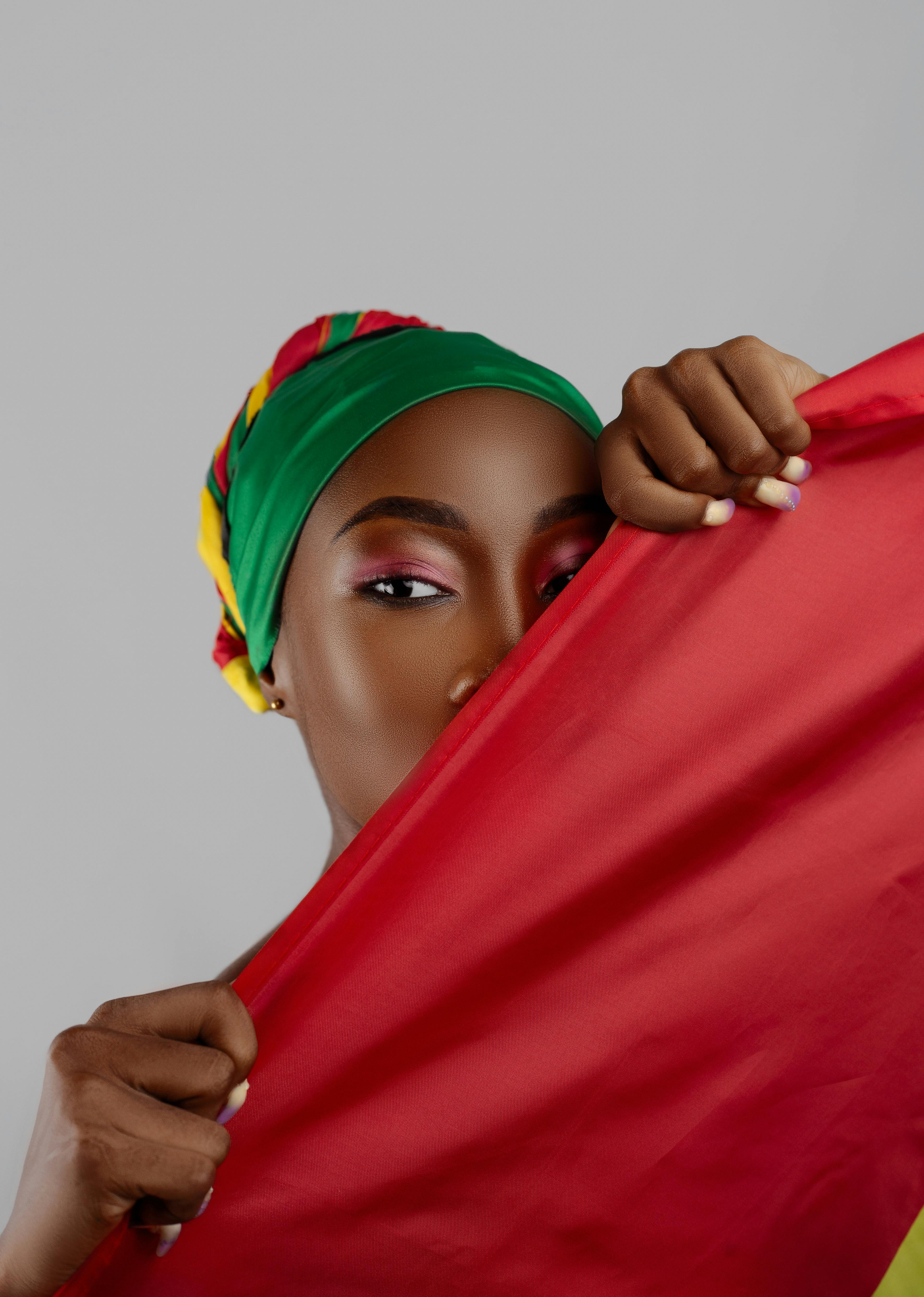 Woman Posing Holding a Sheer Fabric Over Her · Free Stock Photo