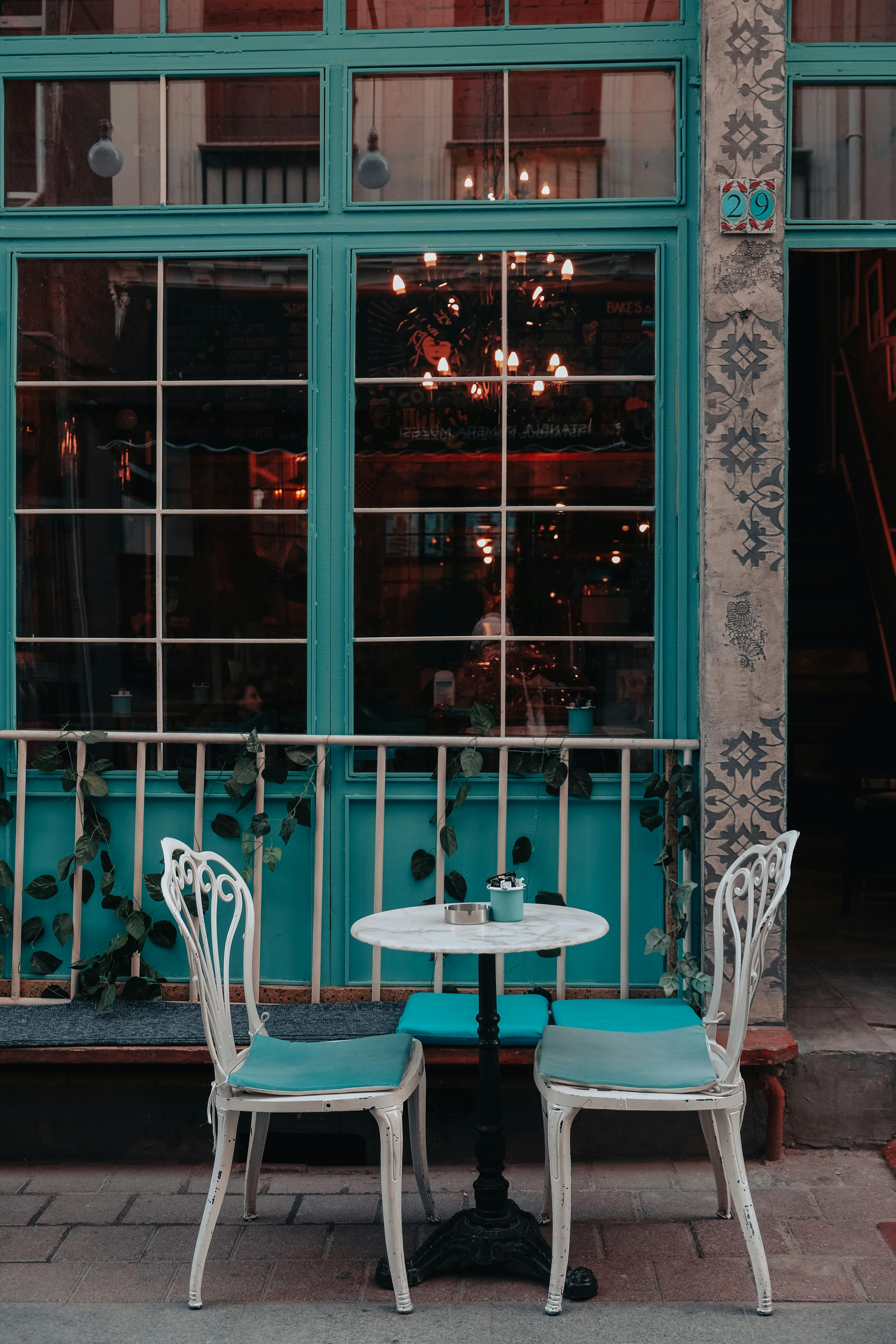 Table and Chairs at the Storefront · Free Stock Photo