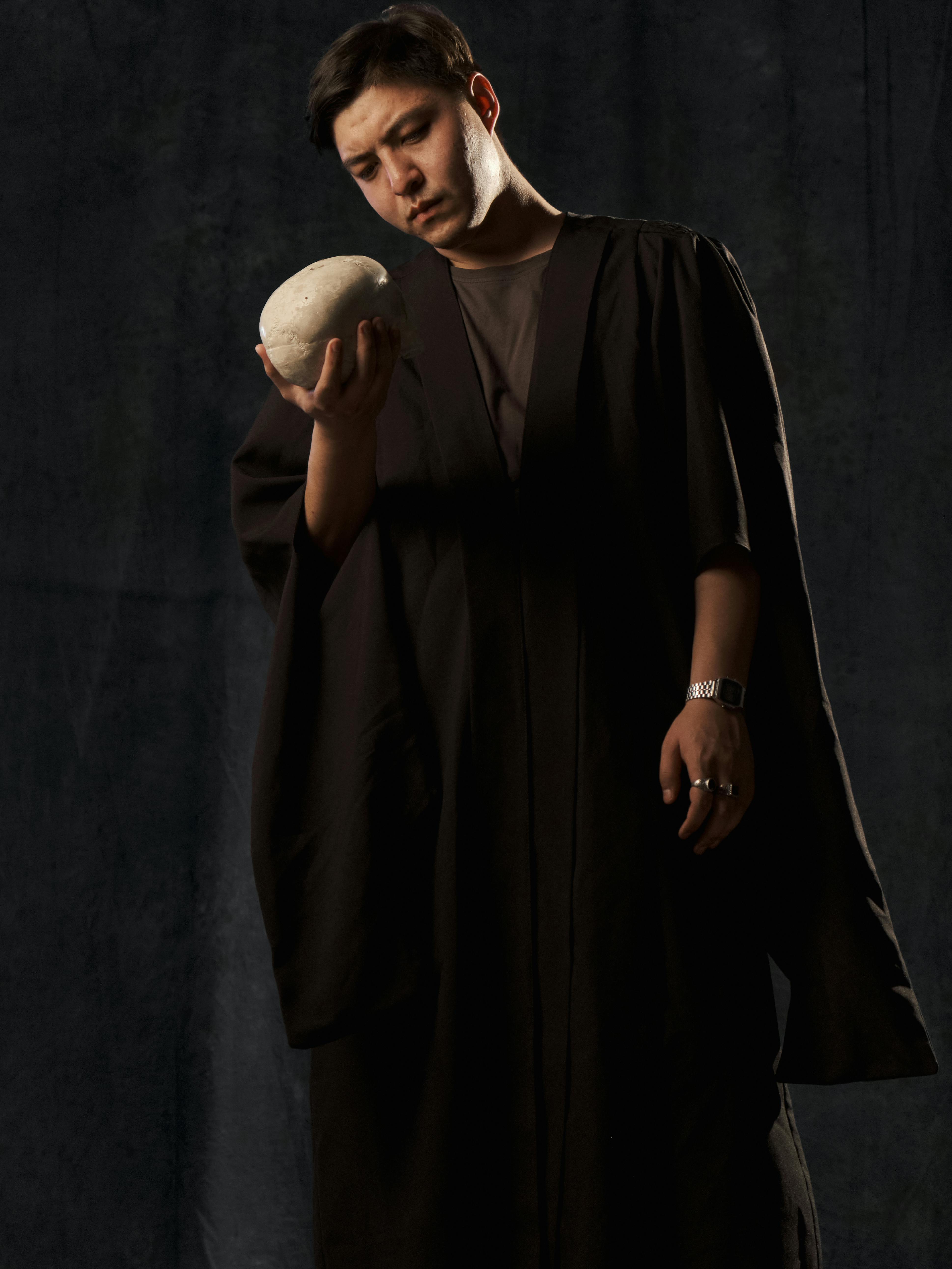 Man in Red Robe Holding Wooden Mask · Free Stock Photo