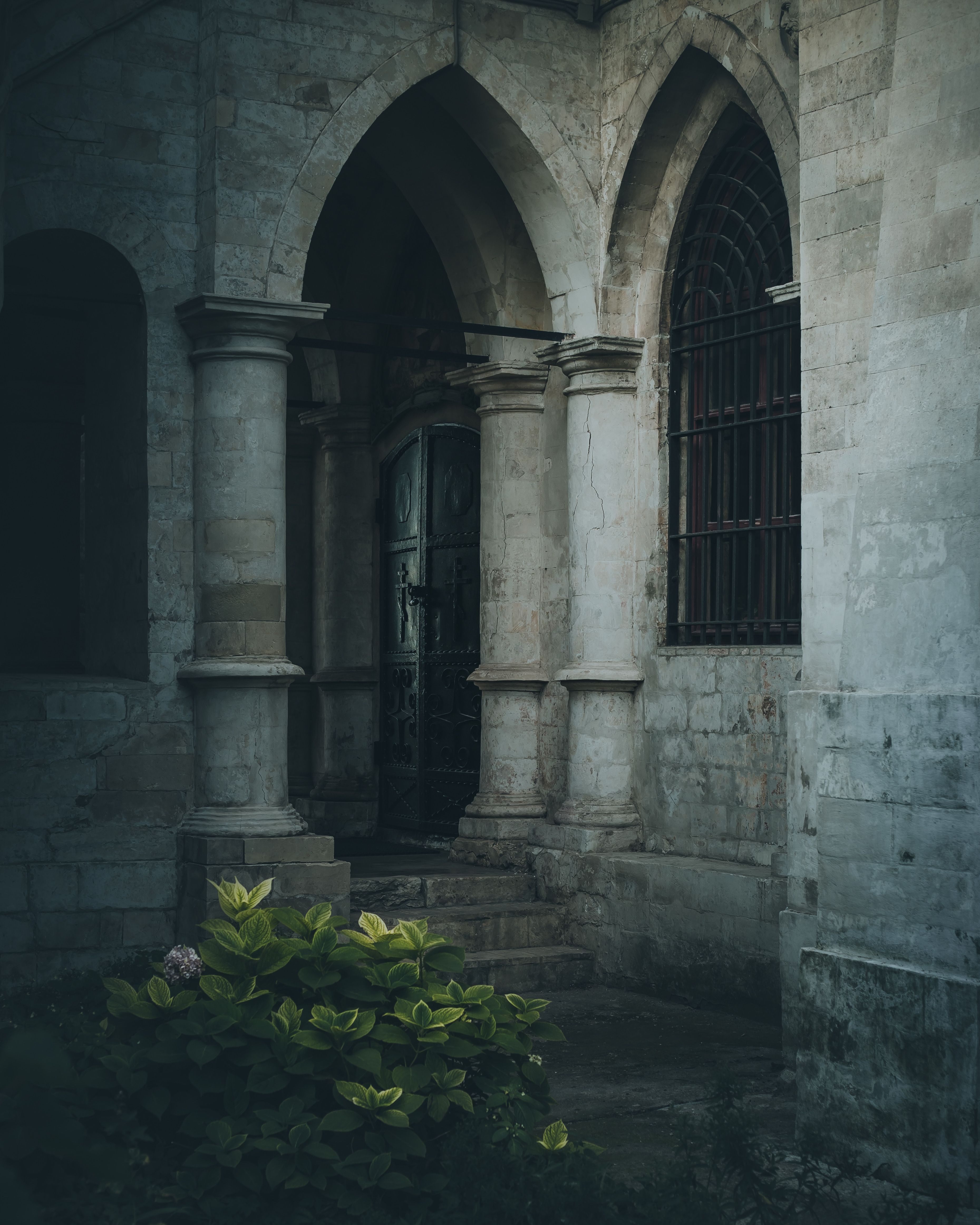 Silhouette Photo of Person Leaning on Arch Pillar · Free Stock Photo