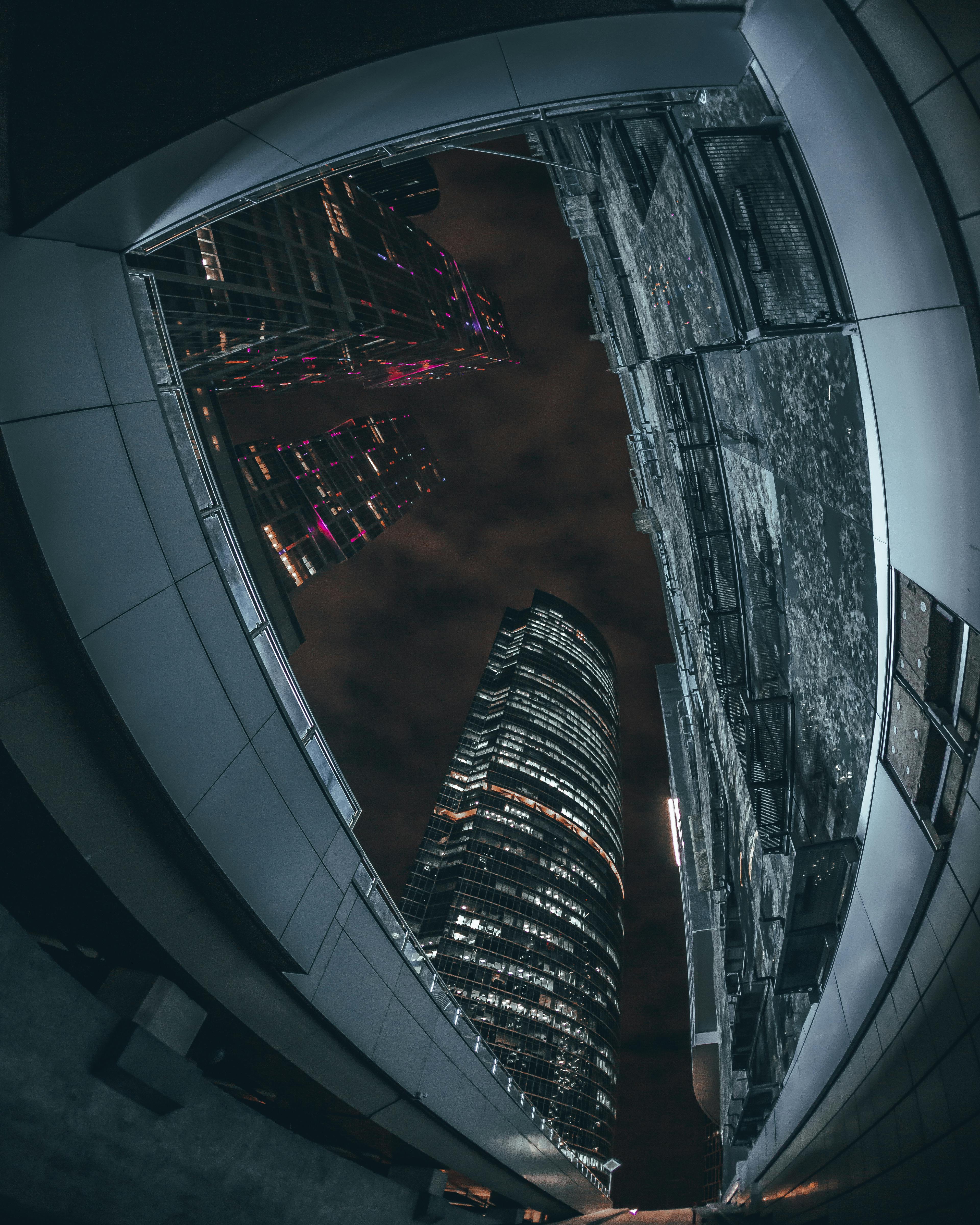 Low-Angle Shot of City Buildings during Nighttime · Free Stock Photo