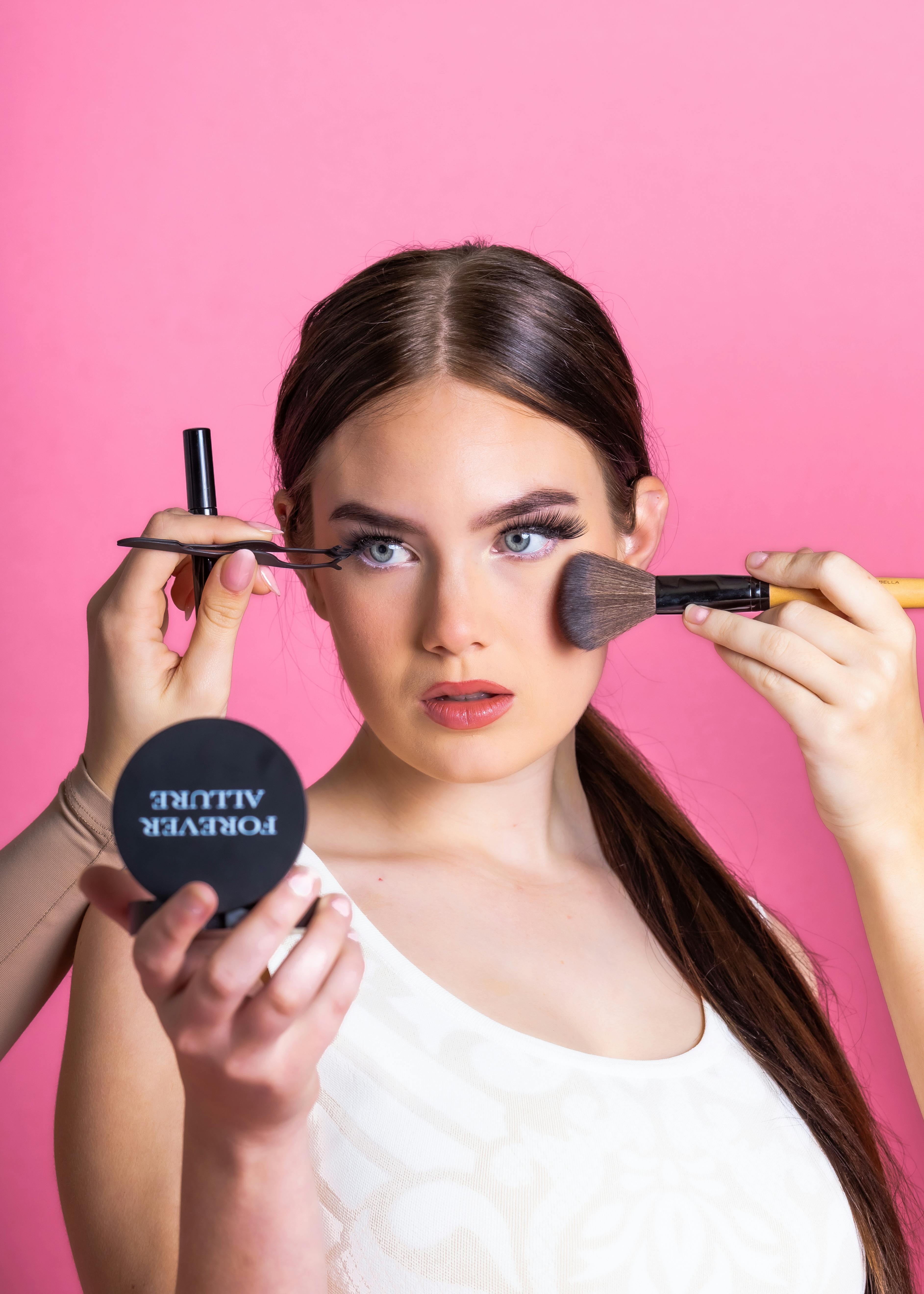People Applying Makeup to a Pretty Woman · Free Stock Photo