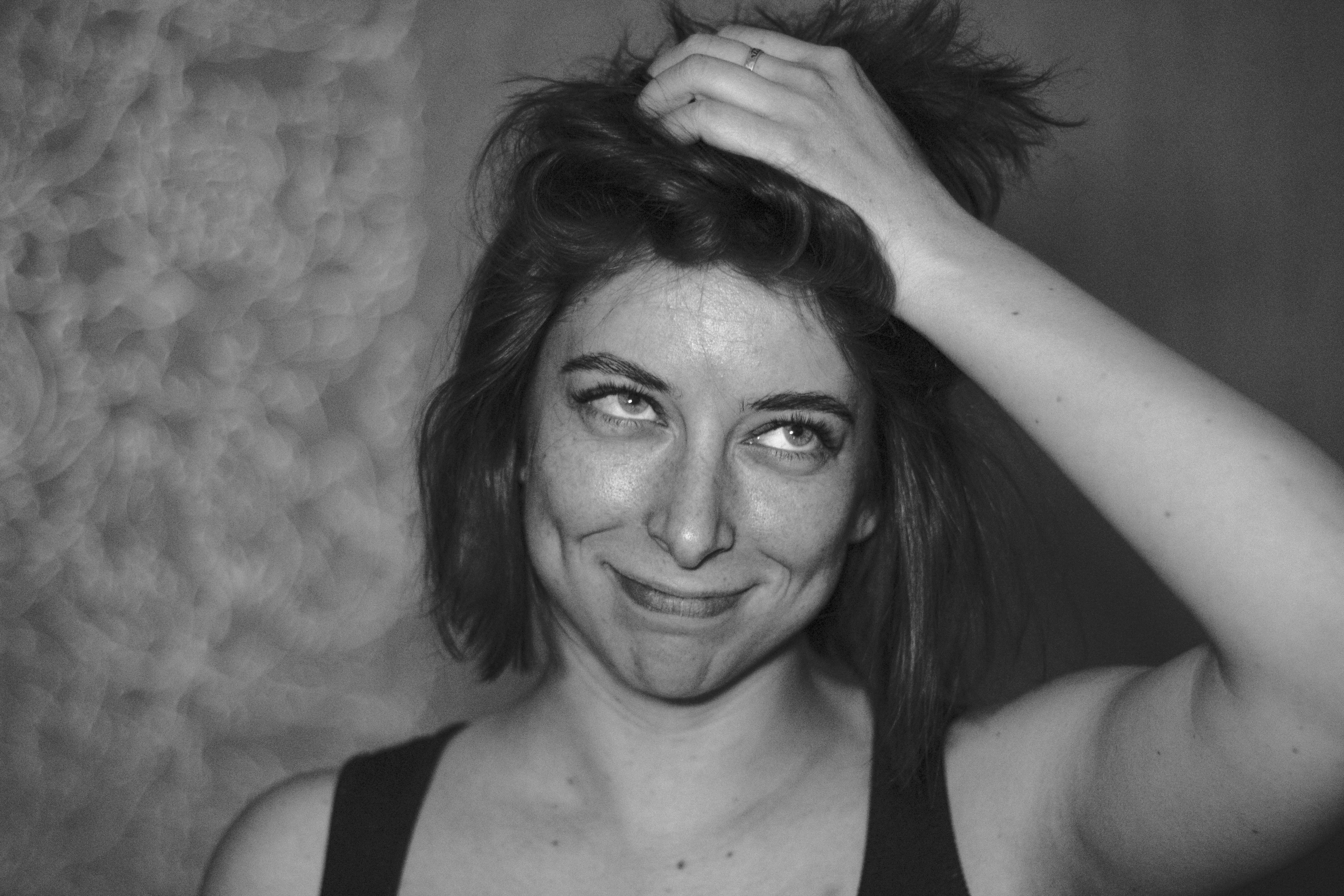 Woman Holding Her Hair · Free Stock Photo