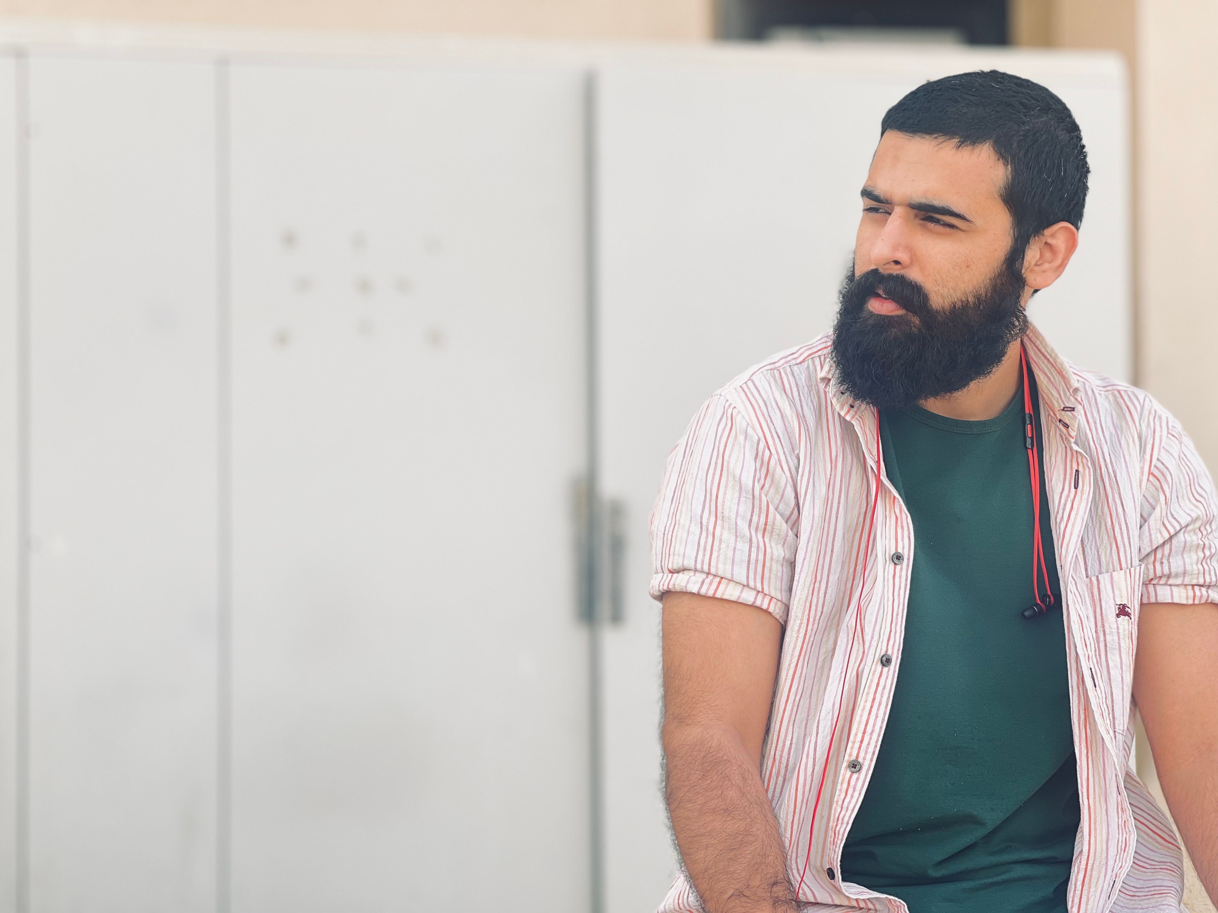 Man Wearing Polo Shirt and Red Cap · Free Stock Photo