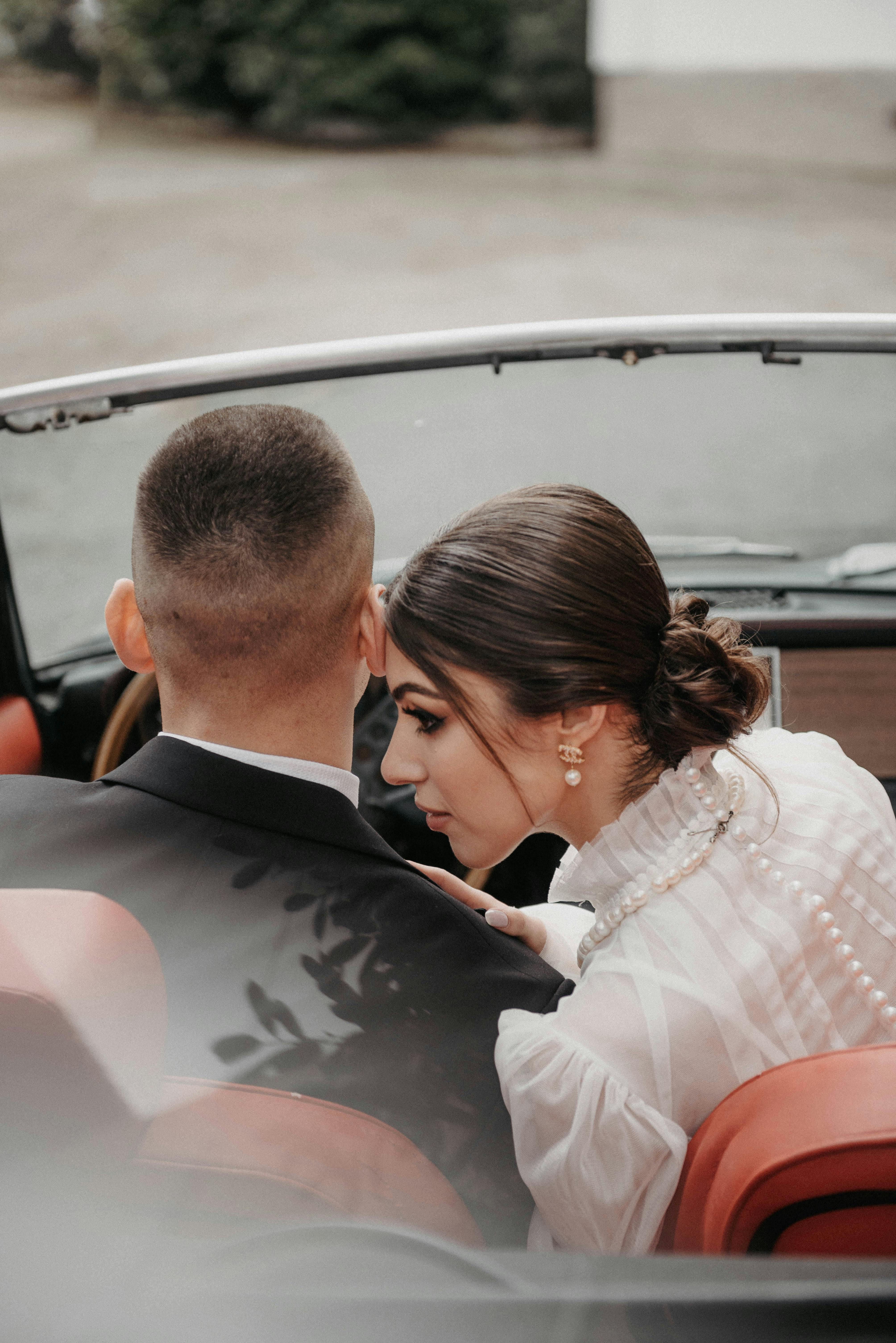 Bride Sitting in Retro Car at Wedding · Free Stock Photo