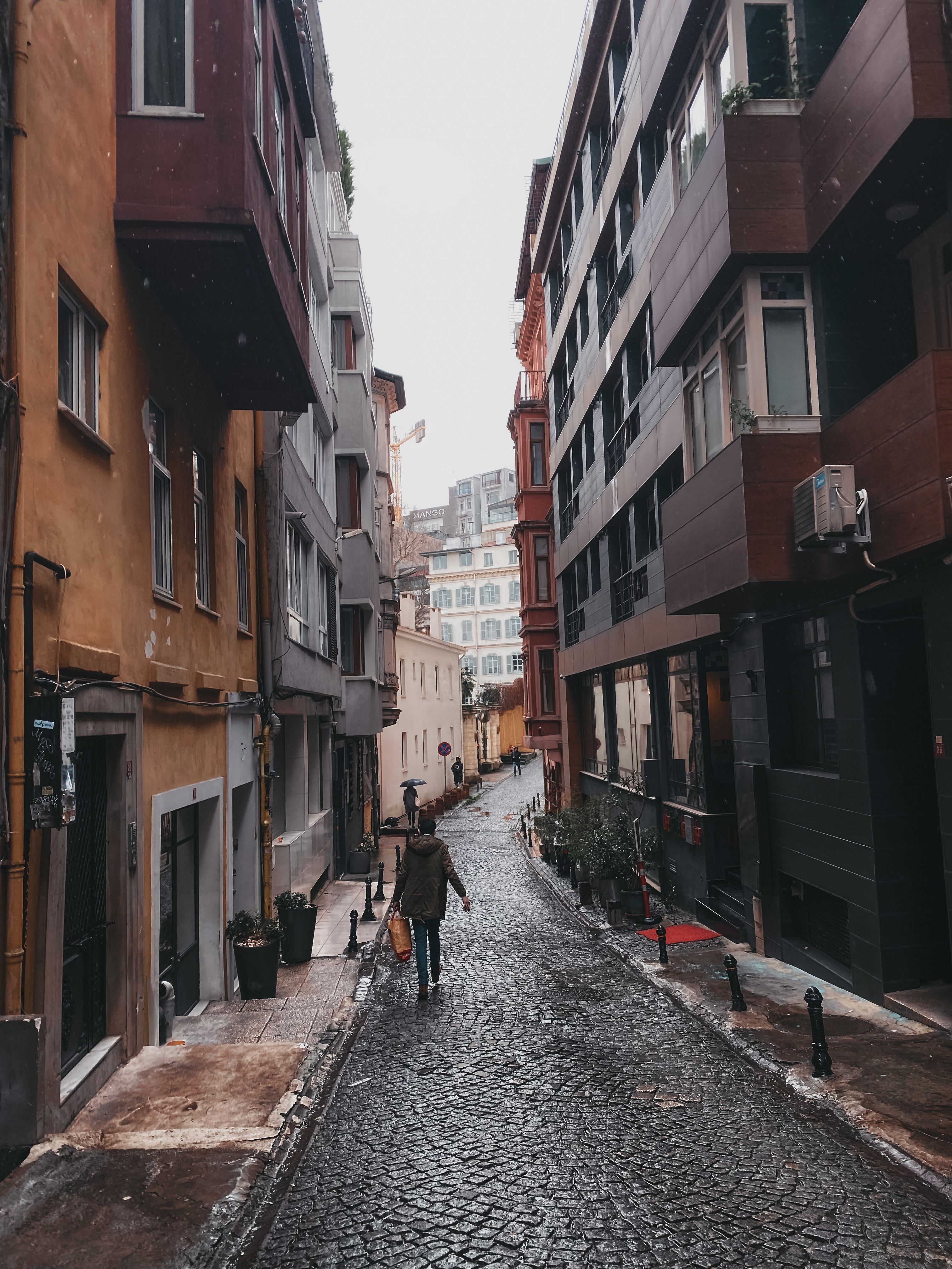 Woman Walking on Empty Street in Town · Free Stock Photo