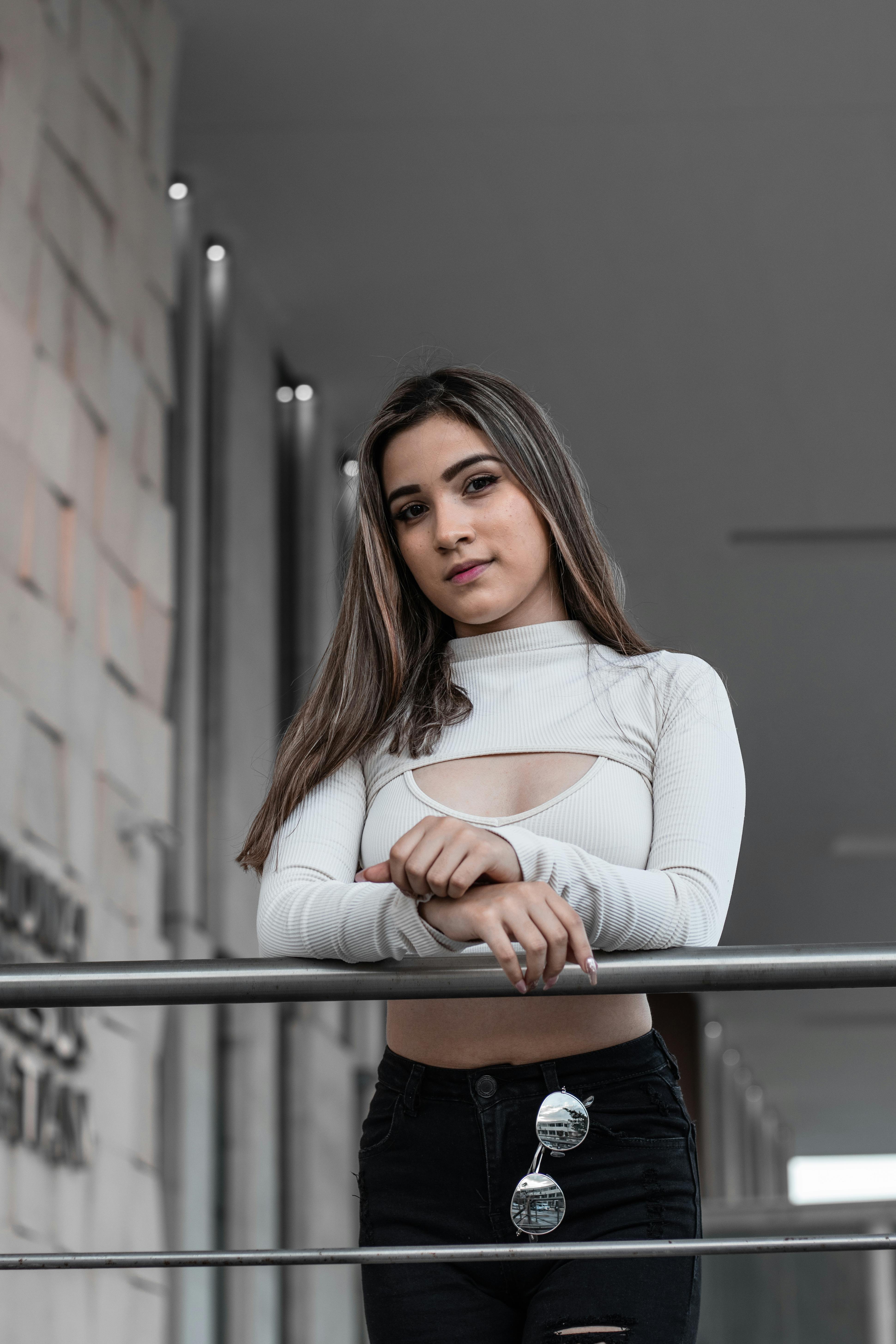 Person Leaning on a Railing · Free Stock Photo