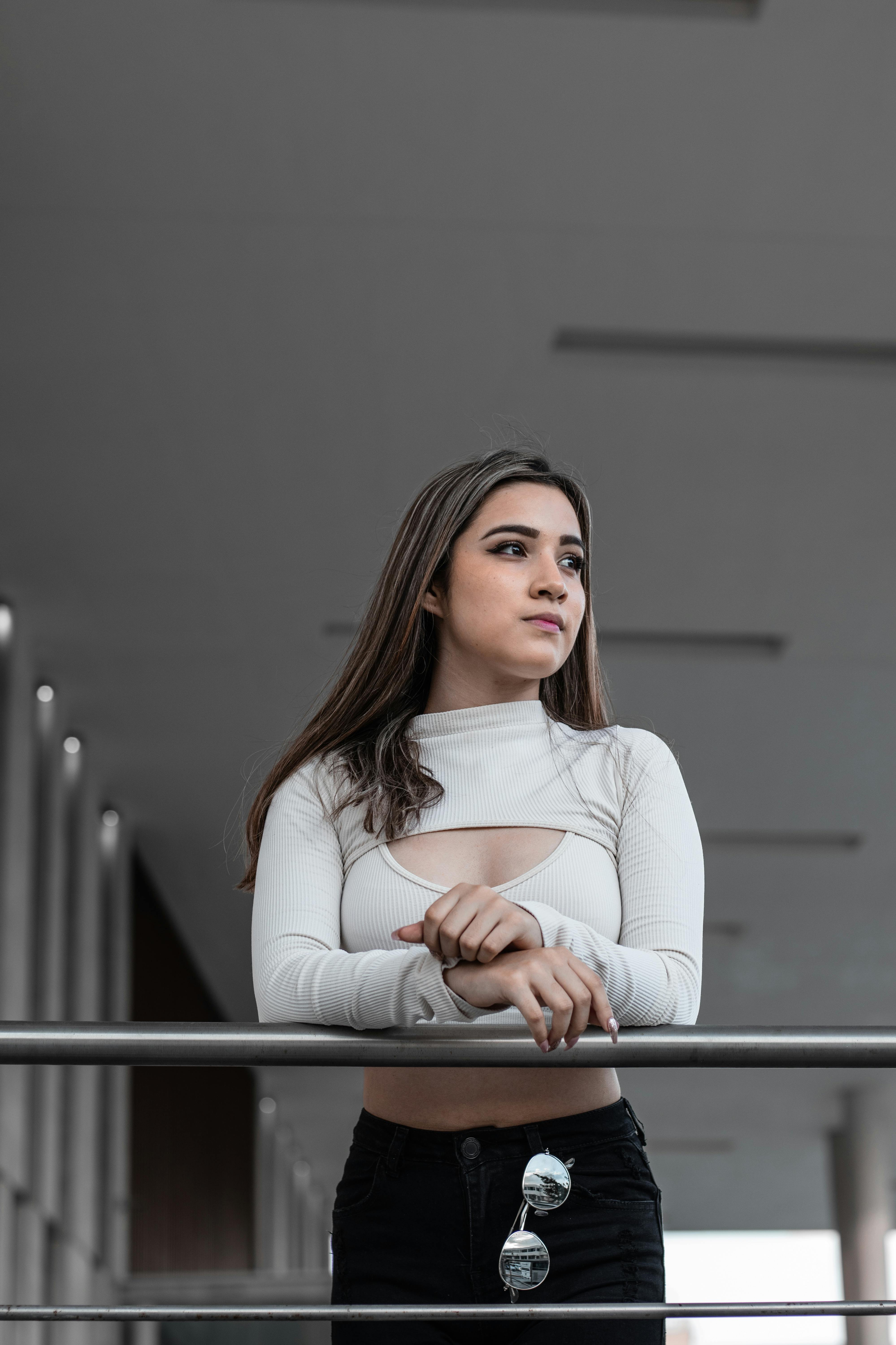 Beautiful Woman Leaning on Railing · Free Stock Photo