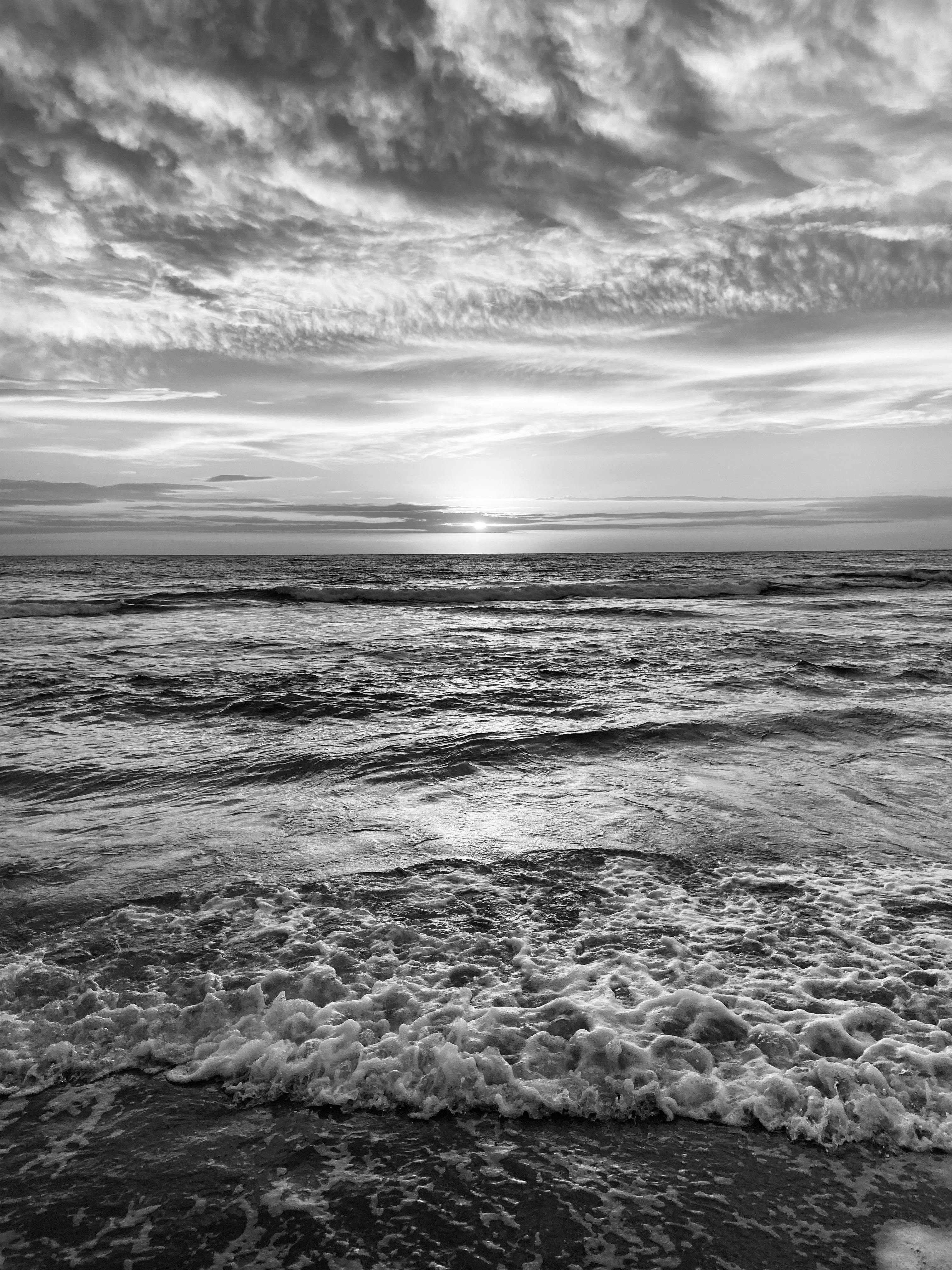 Grayscale Photo of Sea Waves Under the Cloudy Sky · Free Stock Photo