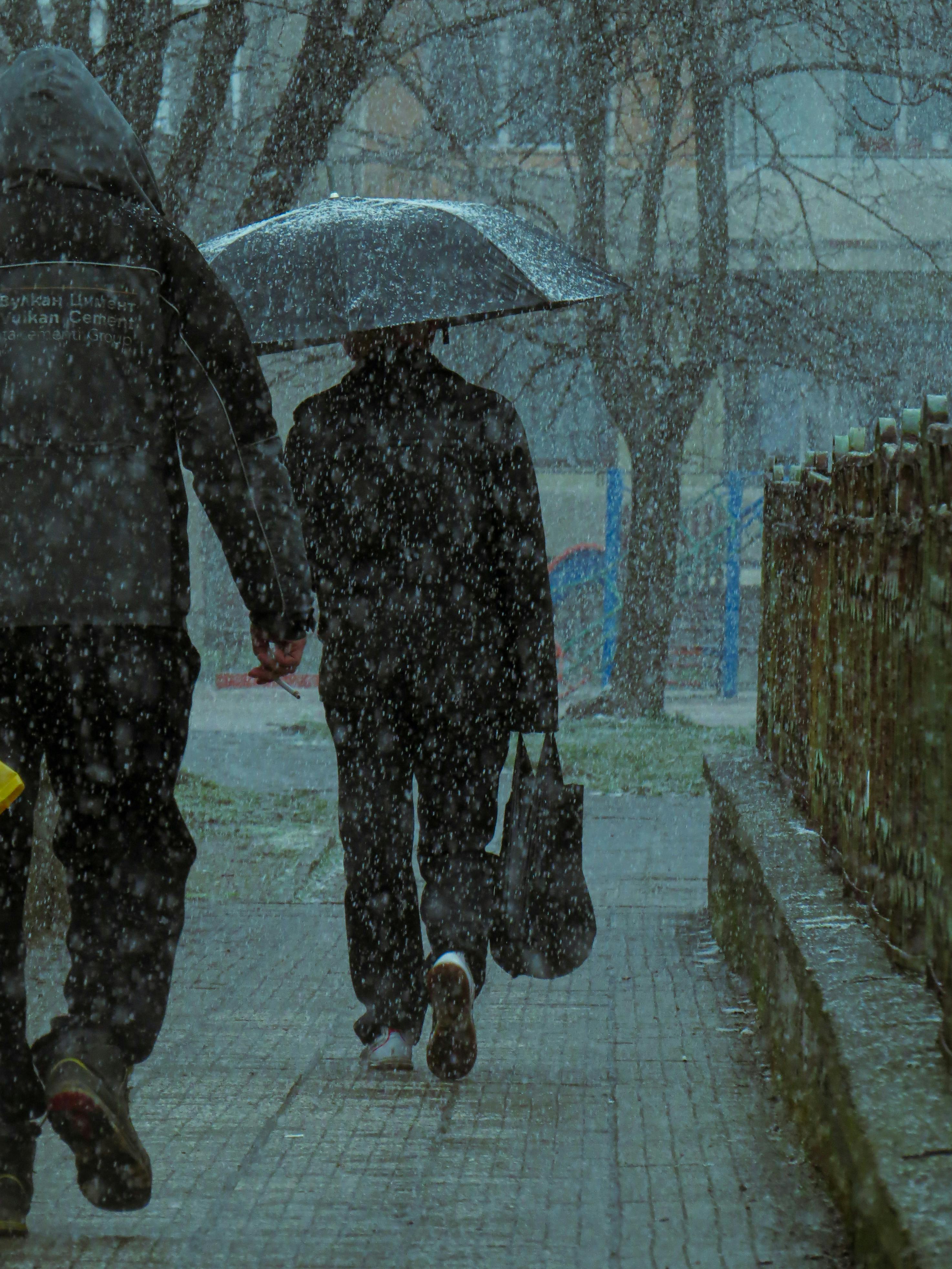 A Man Walking on Snow · Free Stock Photo