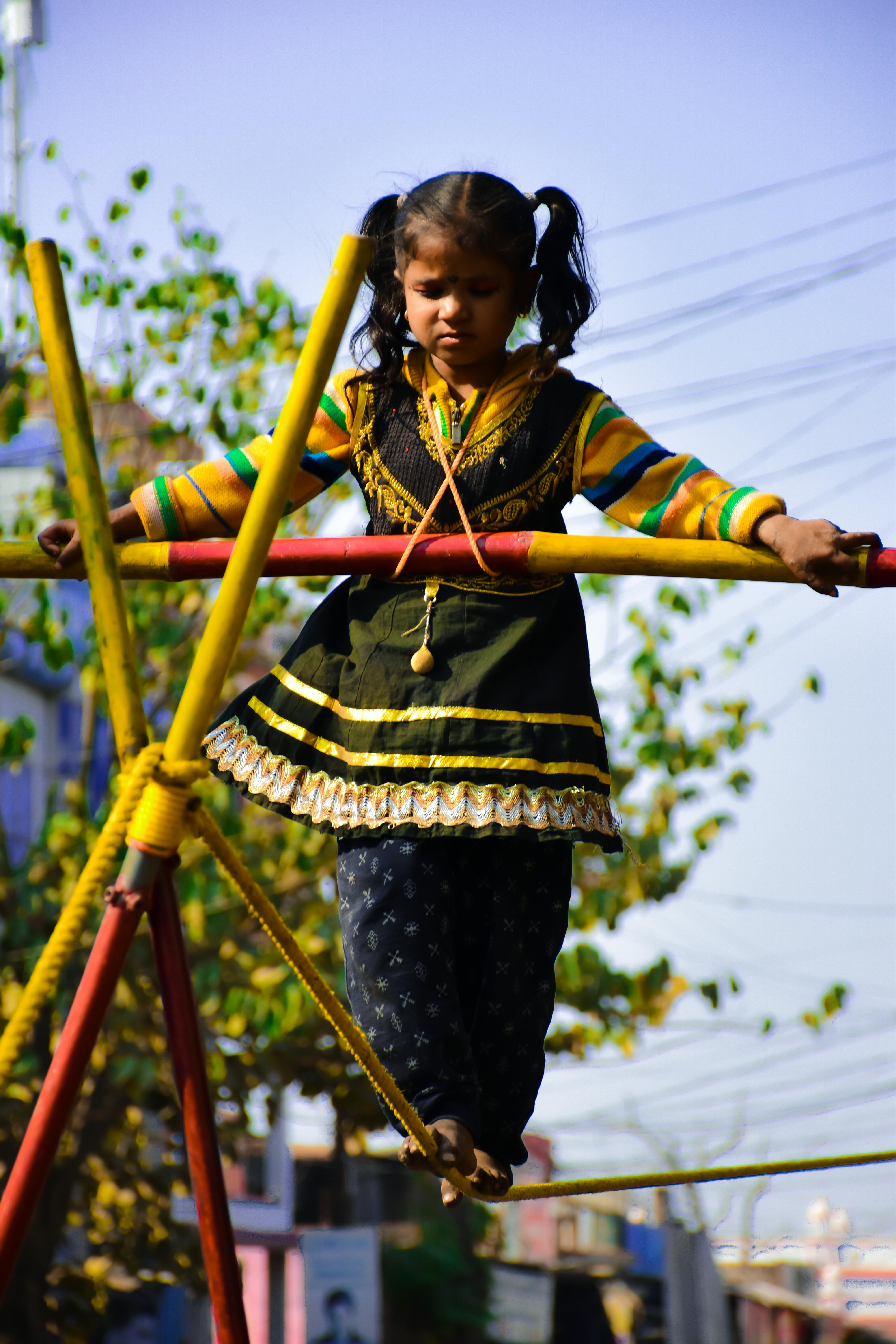A Girl Balancing on a Rope · Free Stock Photo