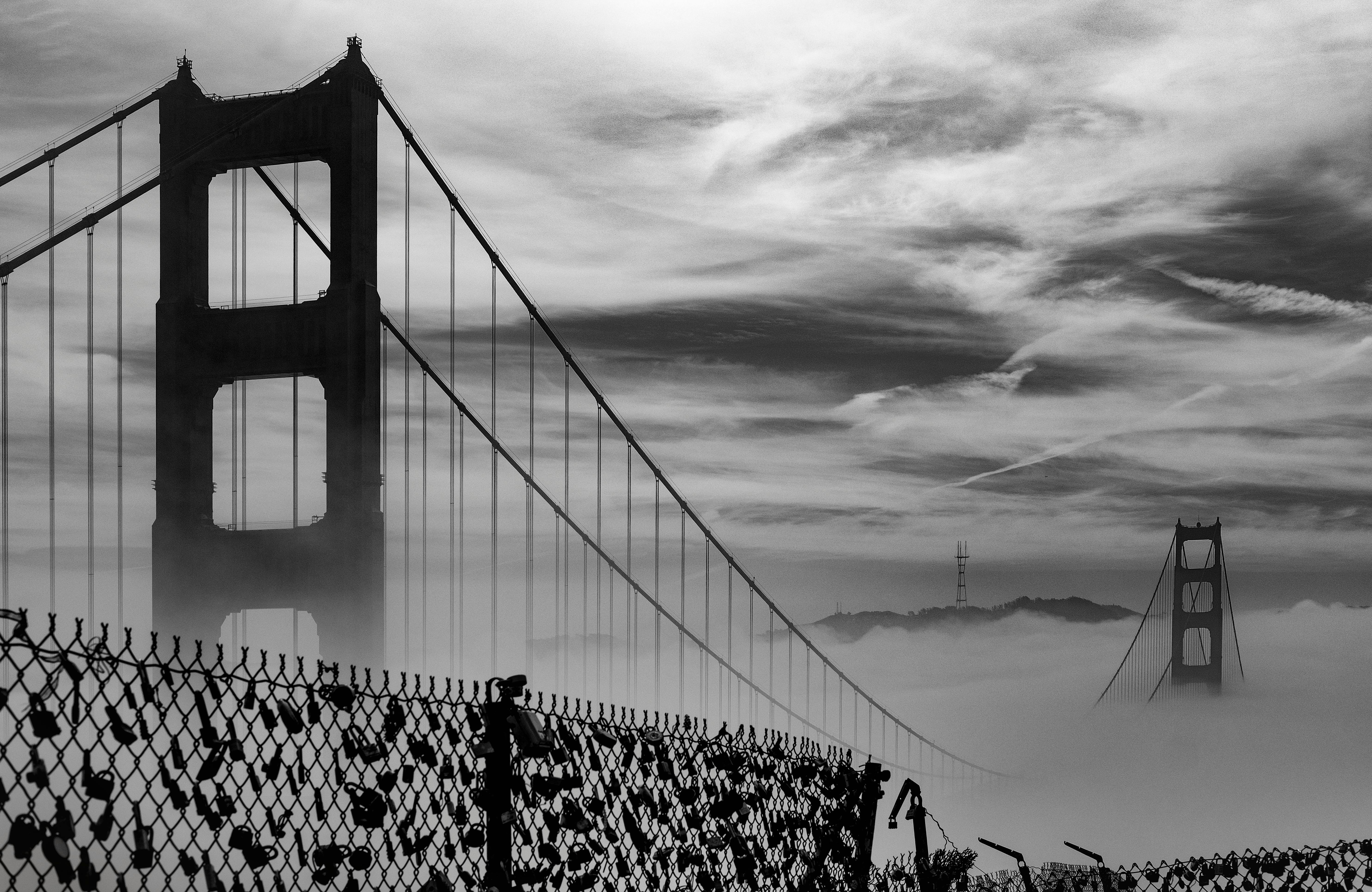 Grayscale Photo of Golden Gate Bridge Under Gloomy Sky · Free Stock Photo